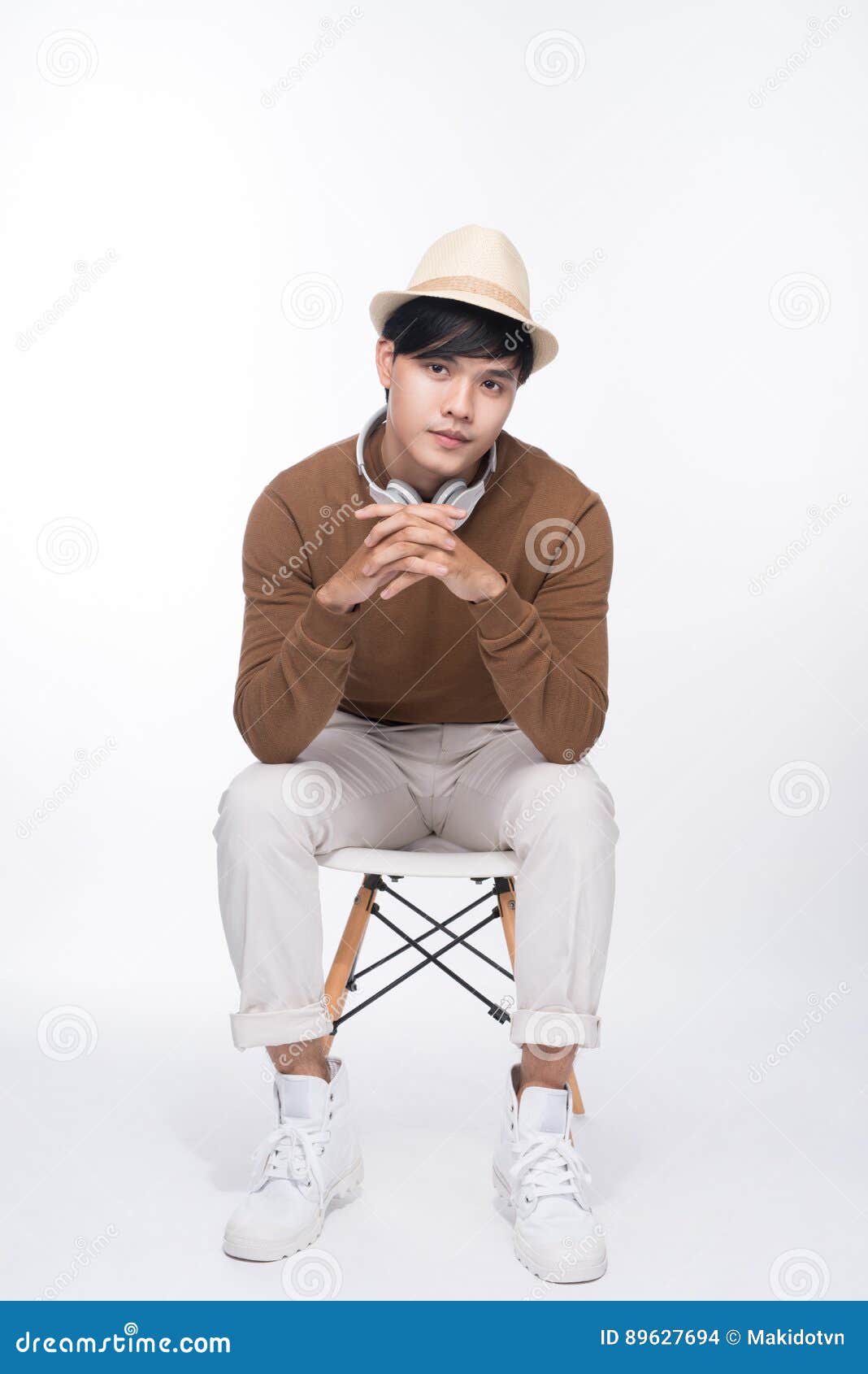 Smart Casual Asian Man Seated on Chair, in Studio Background Stock ...