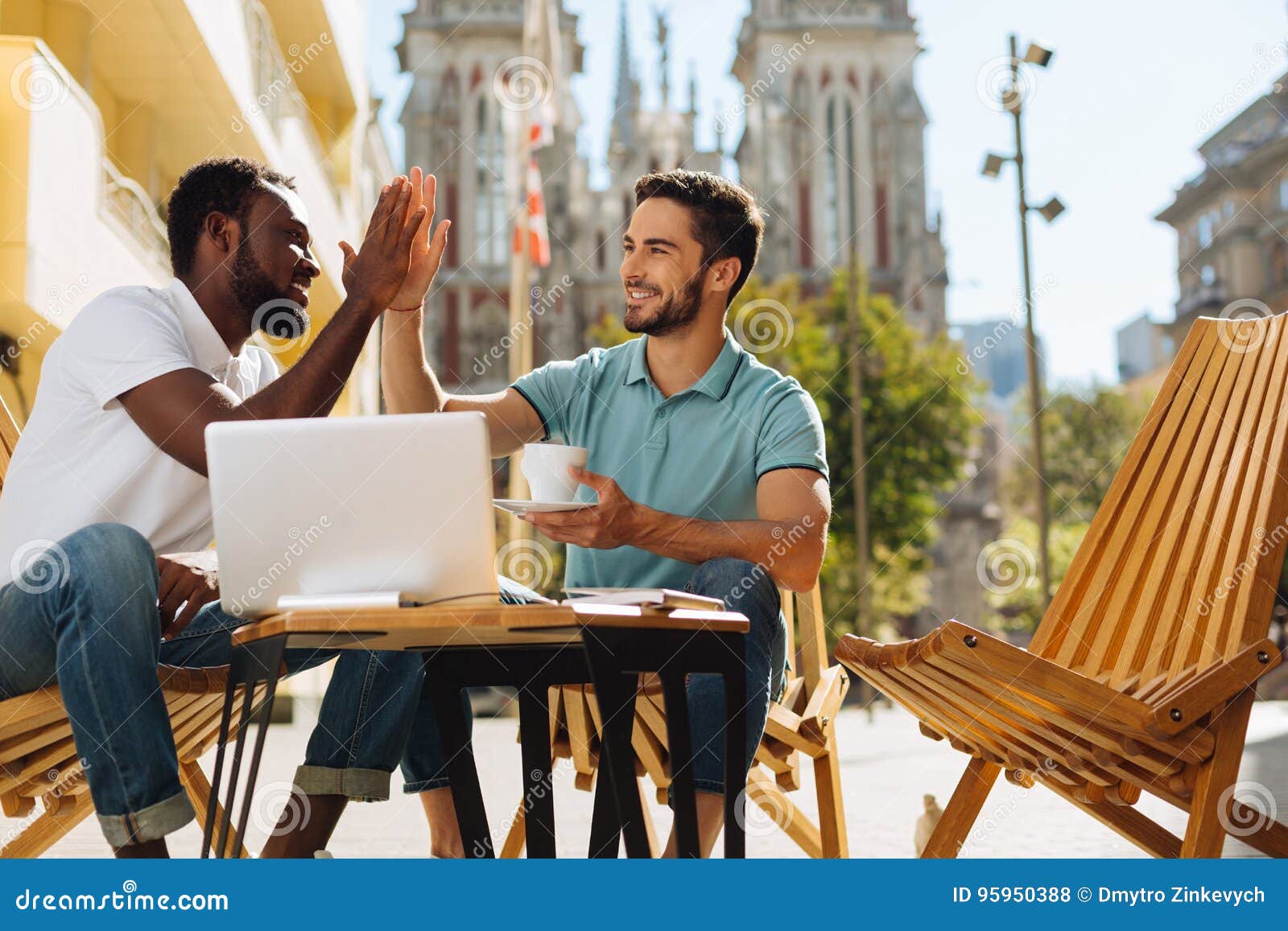 Smart Cheerful Guy Giving His Friend a High Five Stock Photo - Image of ...
