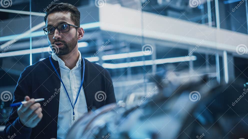 Smart Chief Engineer in Glasses Explaining the Advanced Technology of a ...