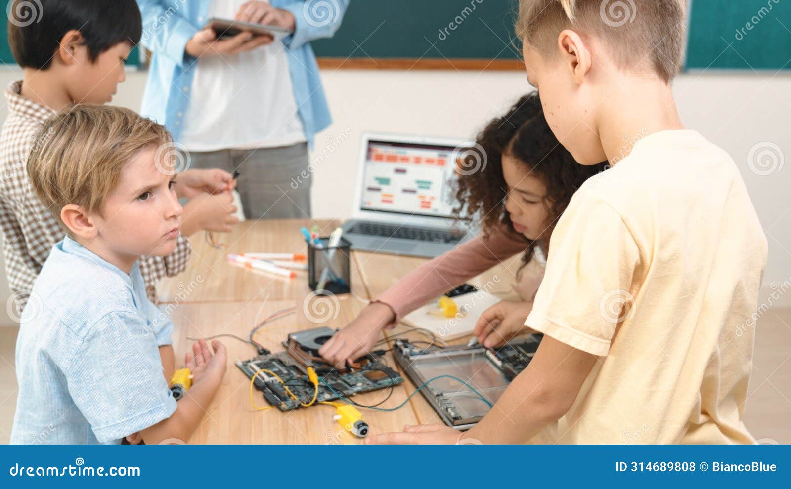 Smart Children Working on Electronic Board while Teacher Using Tablet ...