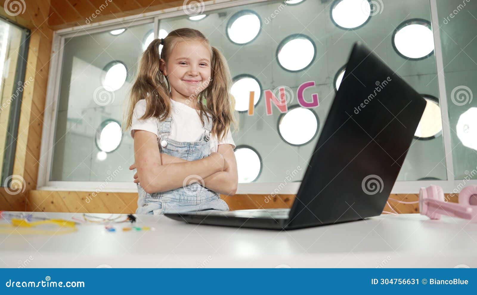 Smart Cute Girl Using Laptop Programing Software while Crossing Arms ...