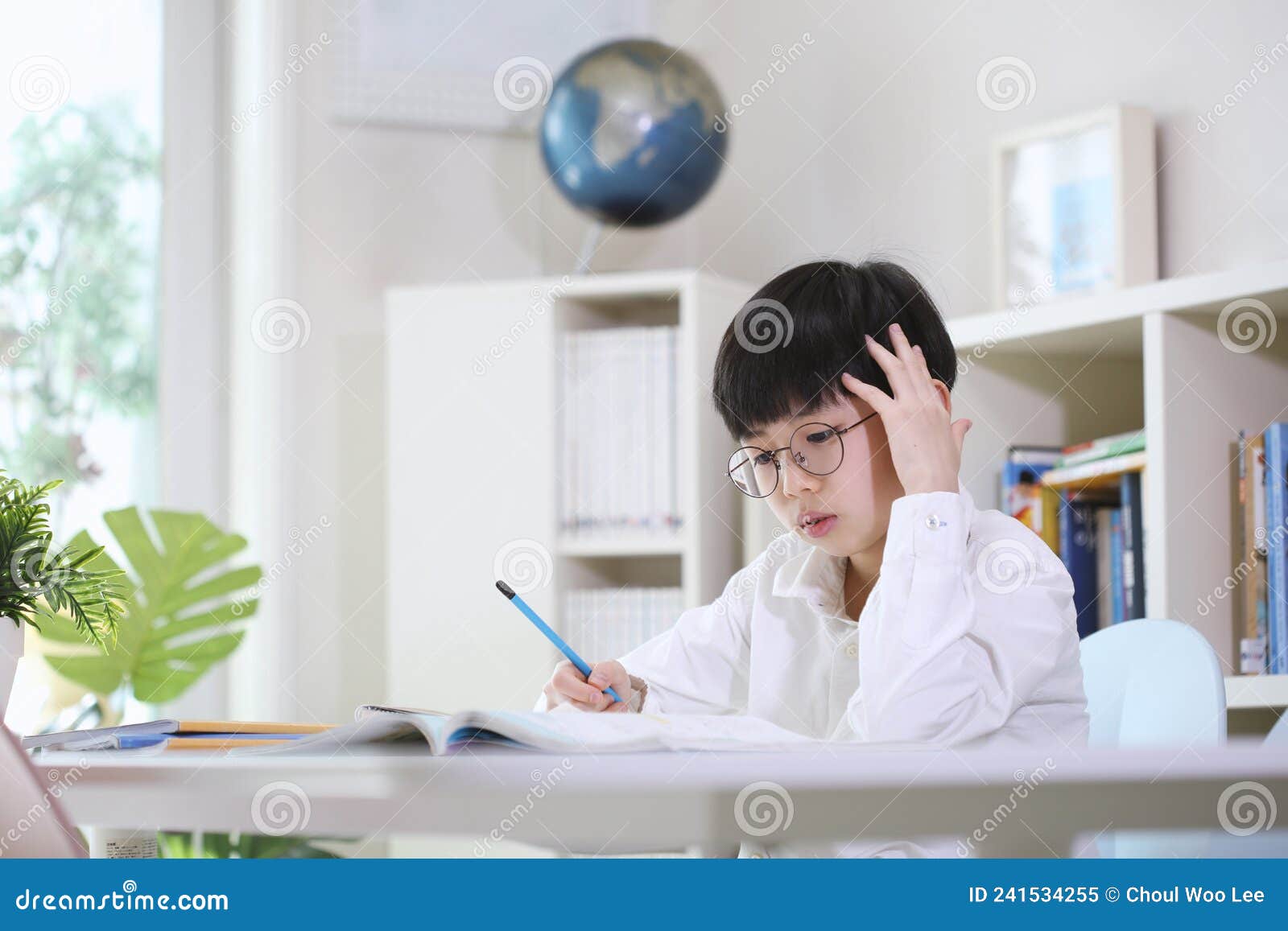 Boy Thinking Carefully, Concentrating and Studying Hard at His Desk ...