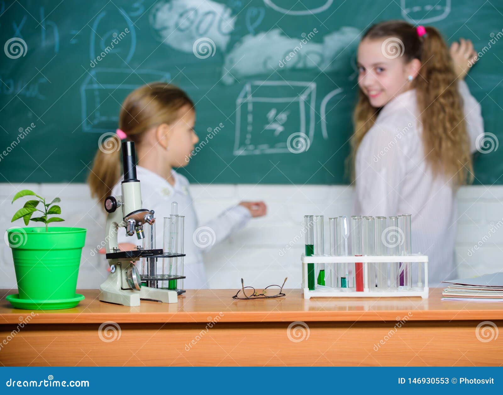 Smart Cuties. School Children in Science Classroom. Microscope and ...