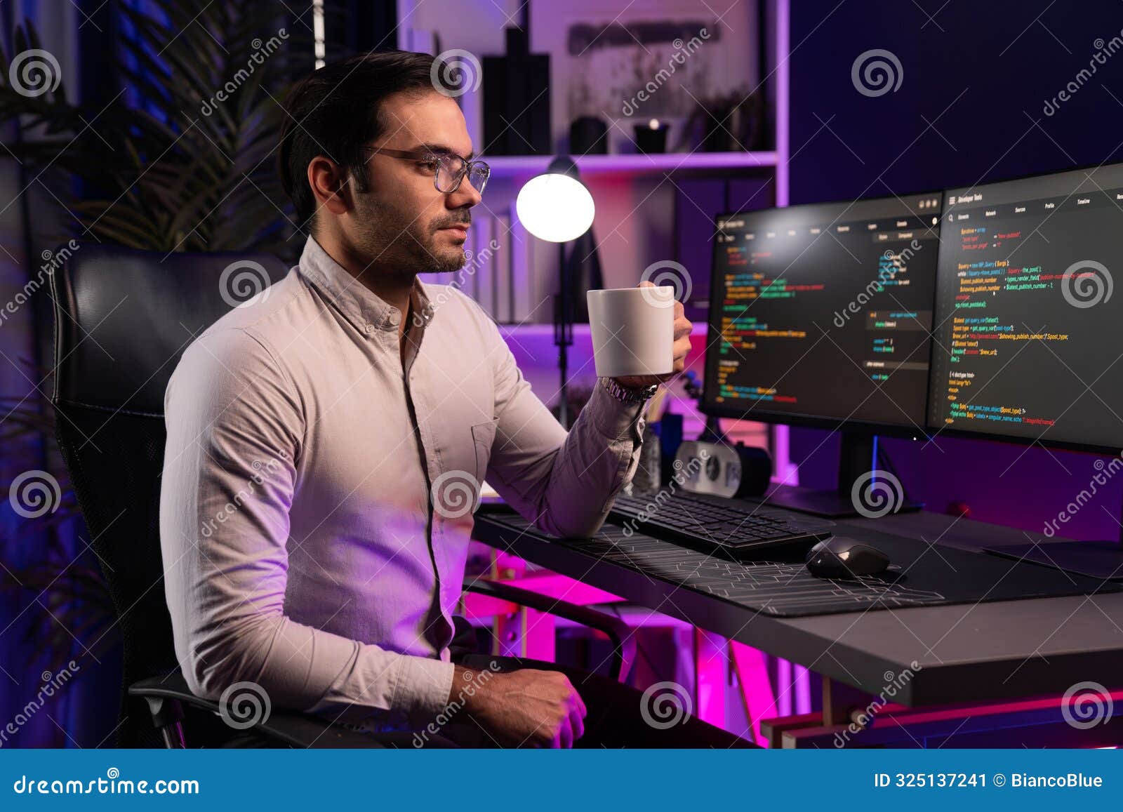 Smart it Developer Holding Coffee Cup with Pose at Neon Light Office ...