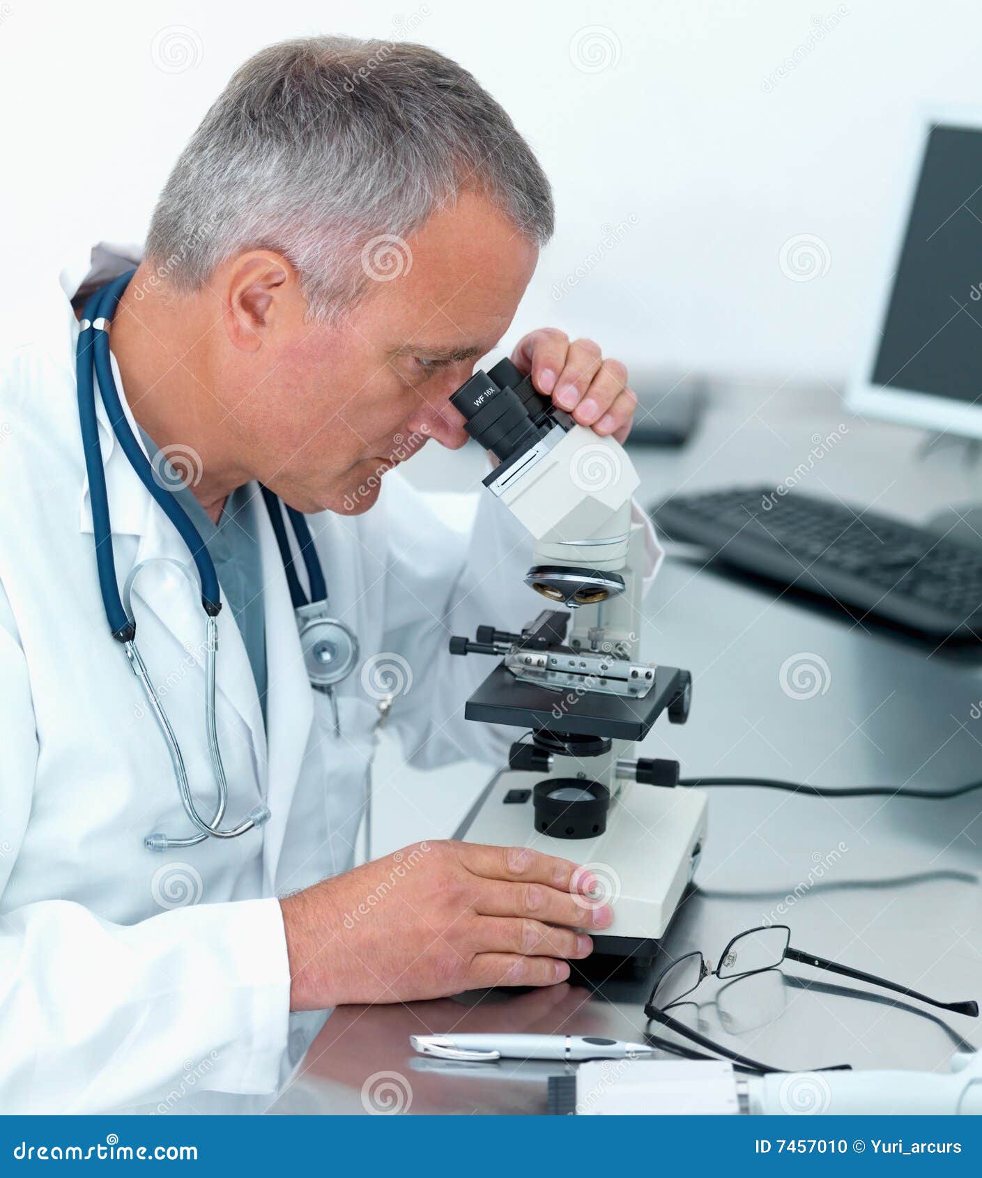 Smart Doctor Thoughtfully Using a Microscope Stock Photo - Image of ...