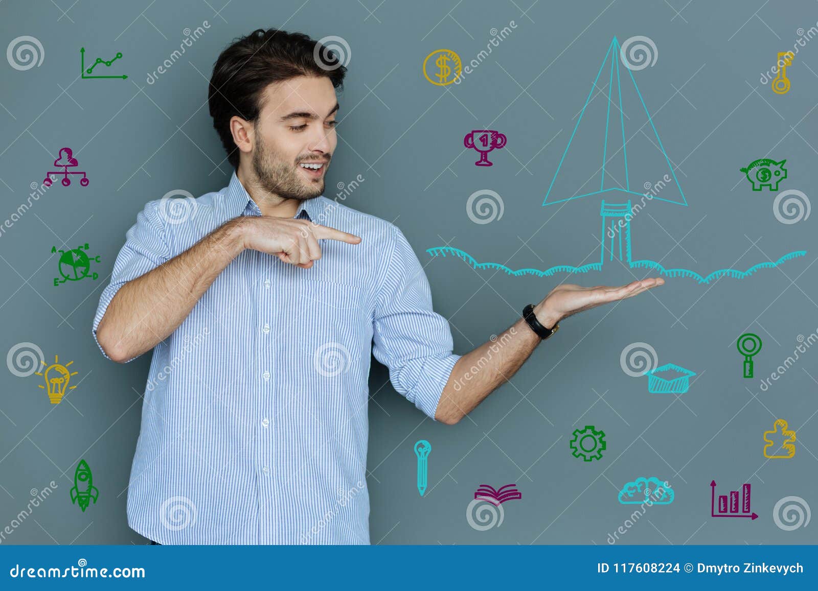 Creative Engineer Looking Excited while Pointing To a Rocket Miniature ...