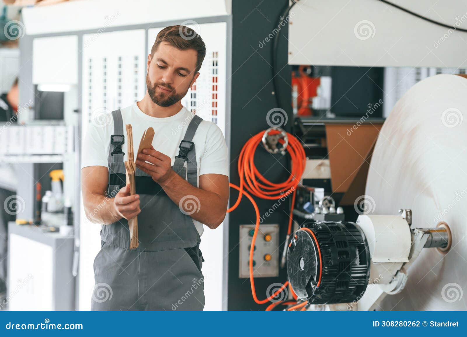 Smart Engineer. Handsome Man is Working at the Factory of Creating Eco ...