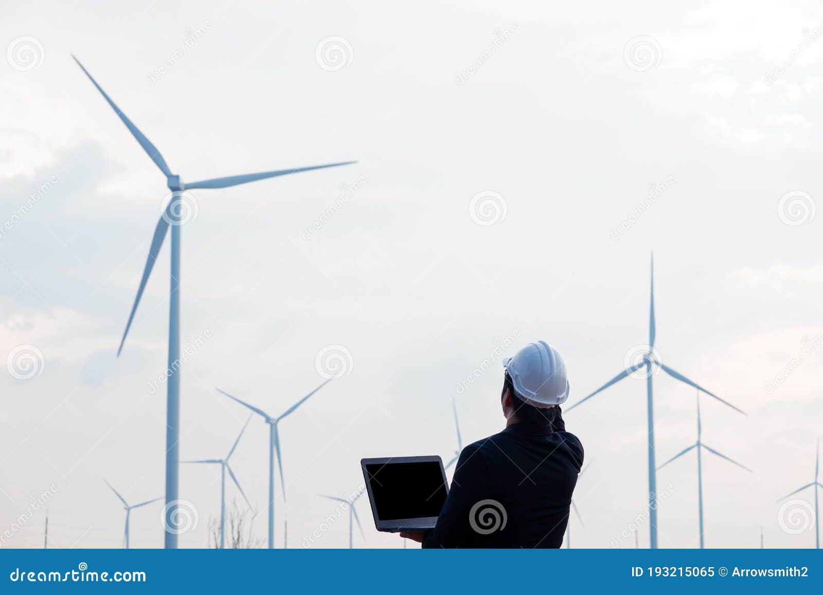 Smart Engineer Man Standing and Using Computer Labtop with Wind Turbine ...