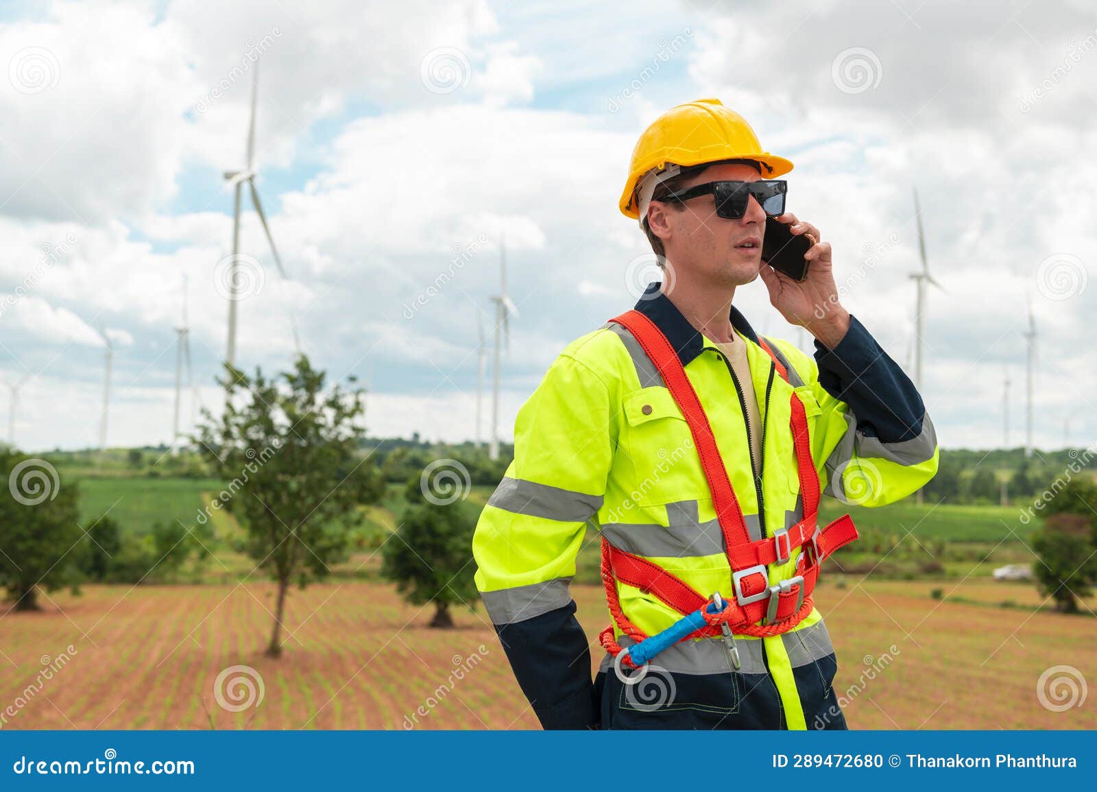 Smart Engineer with Protective Helmet on Head, Using Smartphone at ...
