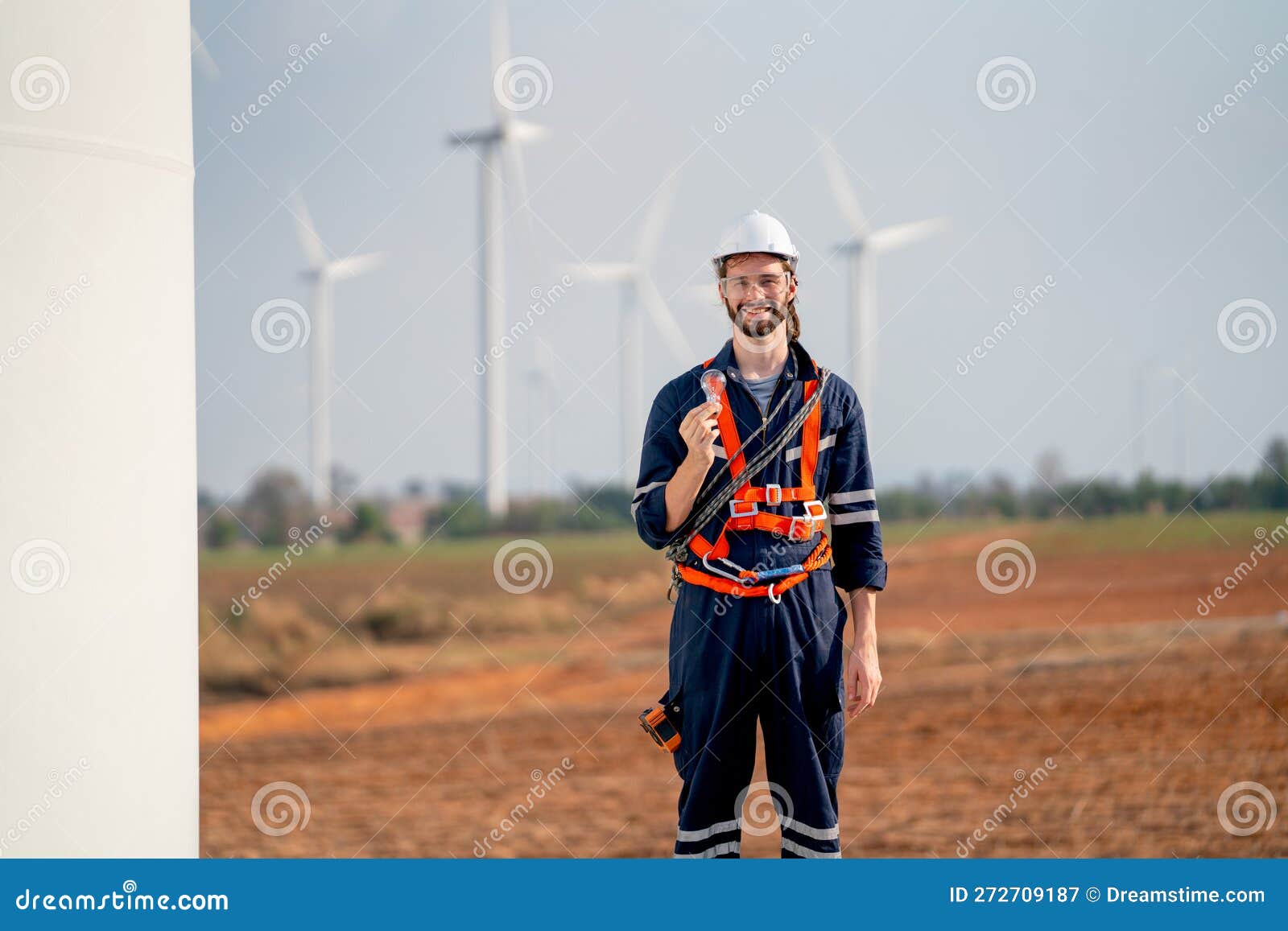 Smart Engineer or Technician Man Stand with Holding Light Bulb and Look ...