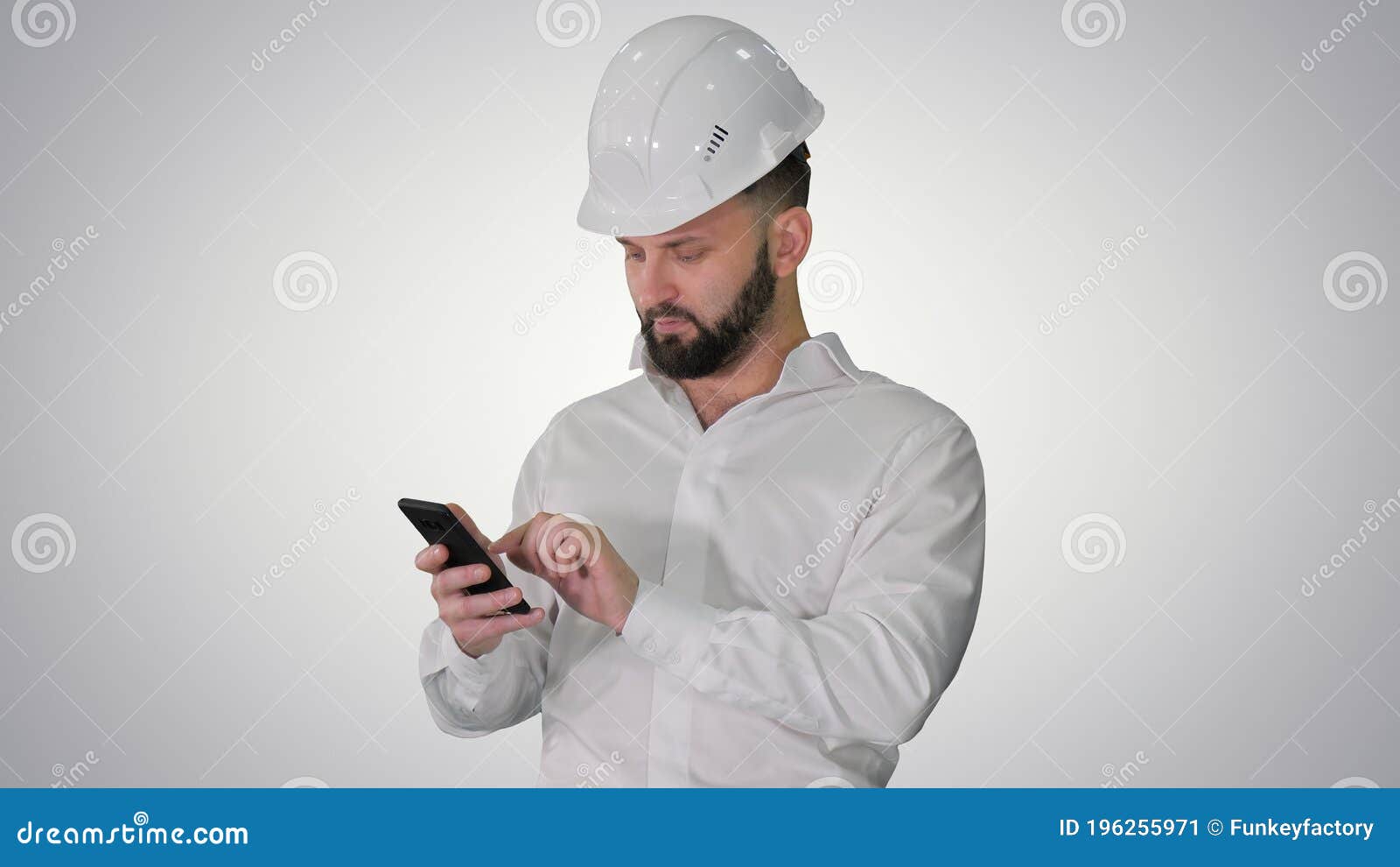 Smart Engineer in White Shirt and Safety Engineering Hat Using S Stock ...