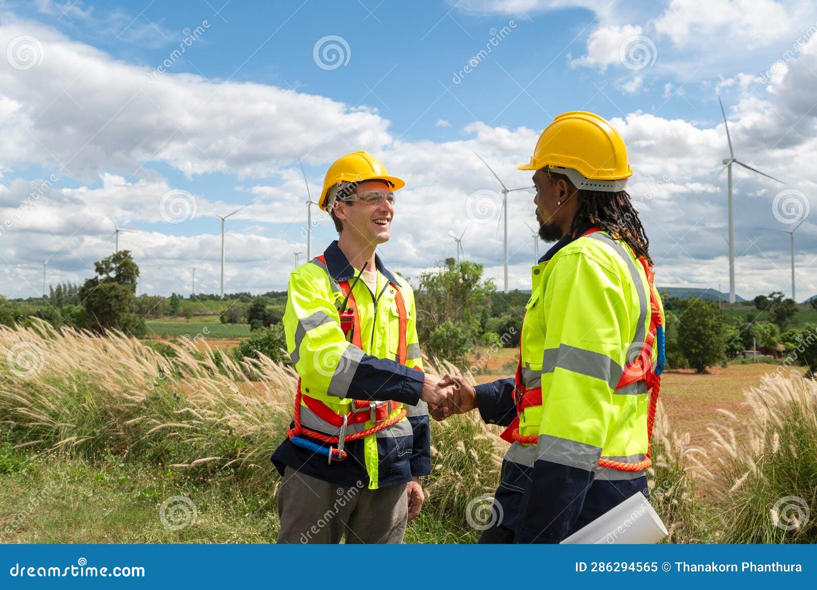 Smart Engineers with Protective Helmet Shaking Hands at Electrical ...