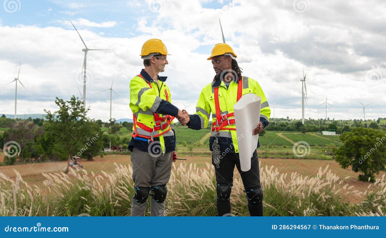 Smart Engineers with Protective Helmet Shaking Hands at Electrical ...