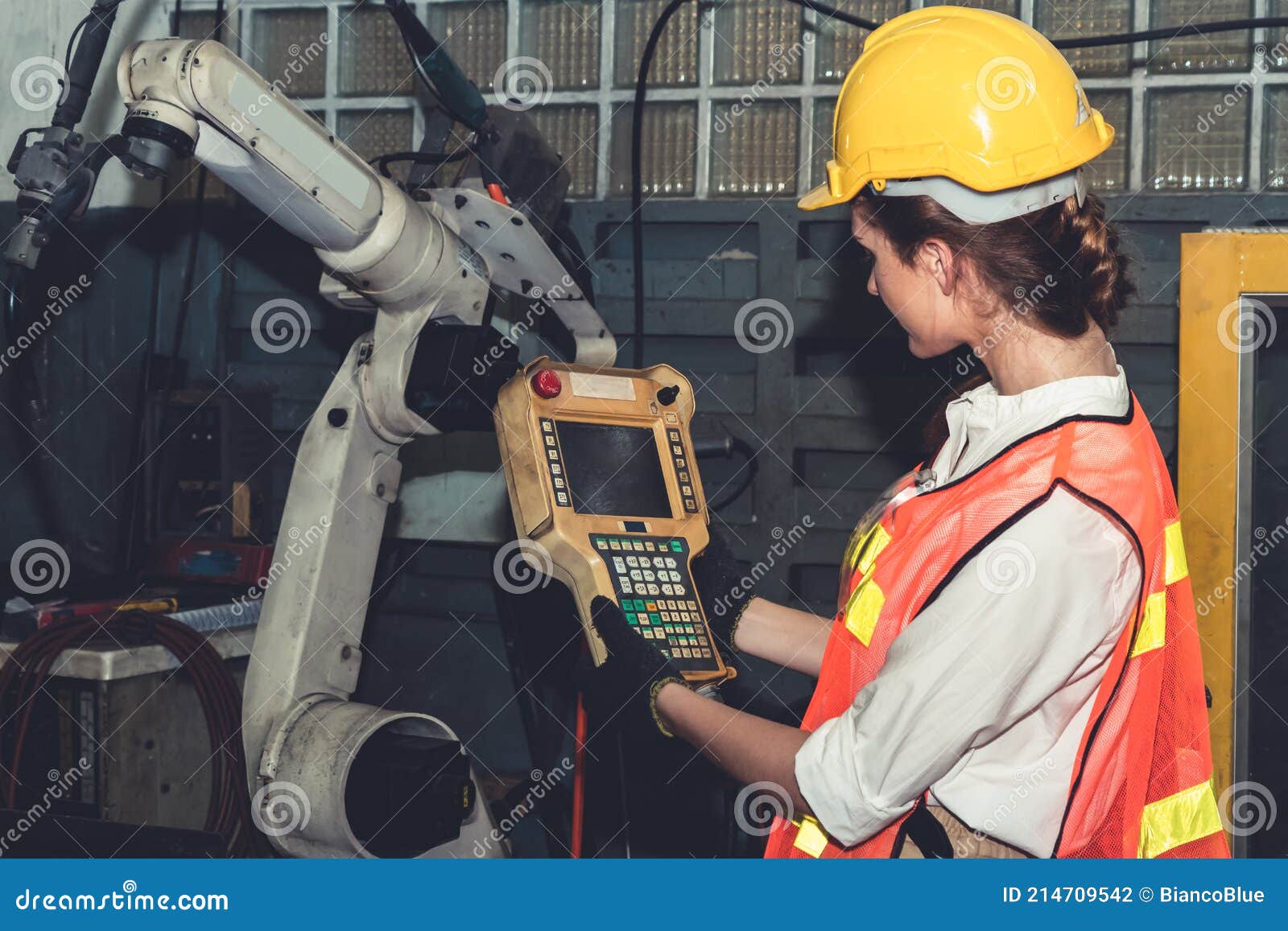Smart Factory Job Worker Control Robotic Arm in Manufacturing Workshop ...
