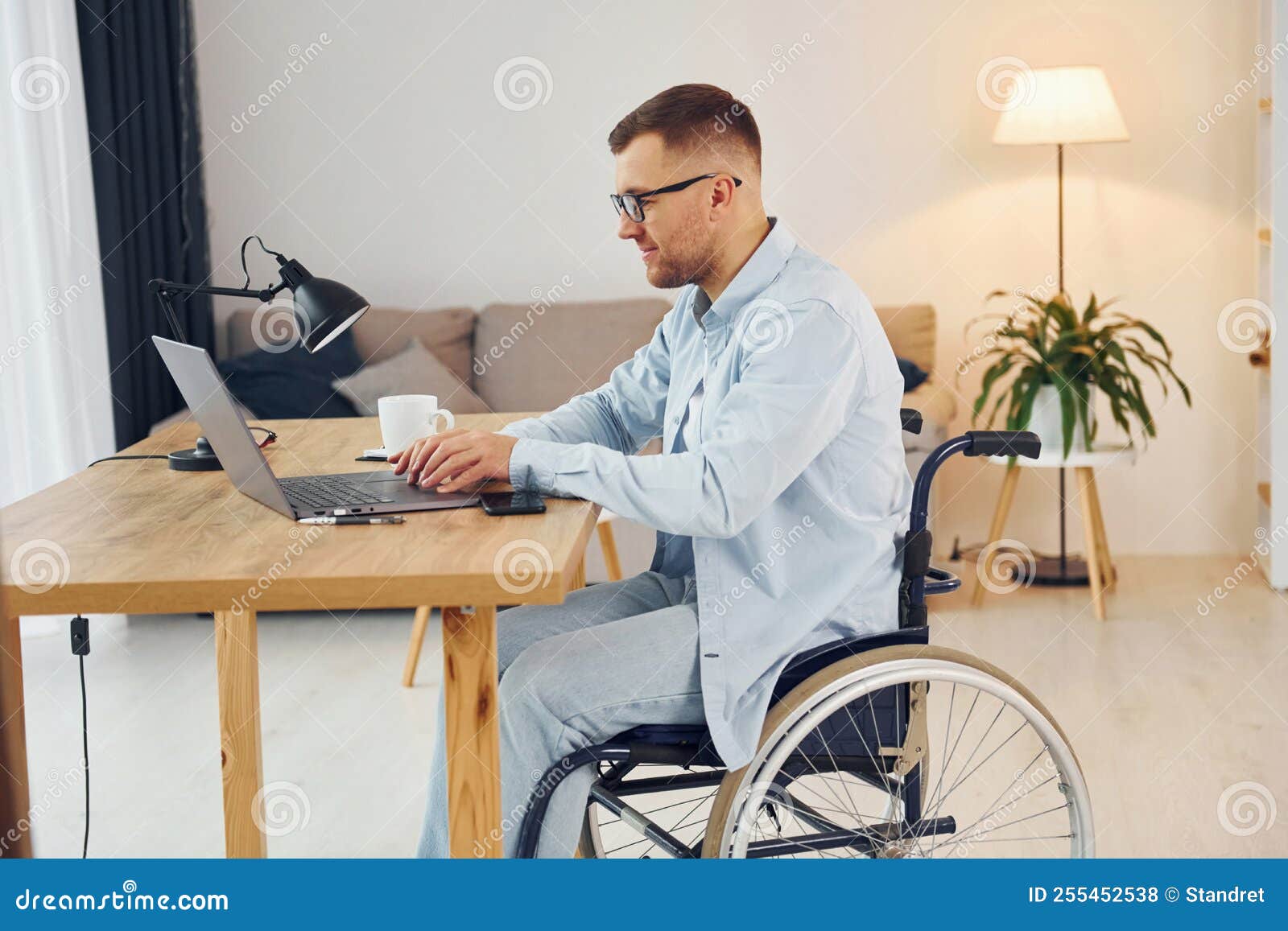 Smart Freelance Worker. Disabled Man in Wheelchair is at Home Stock ...