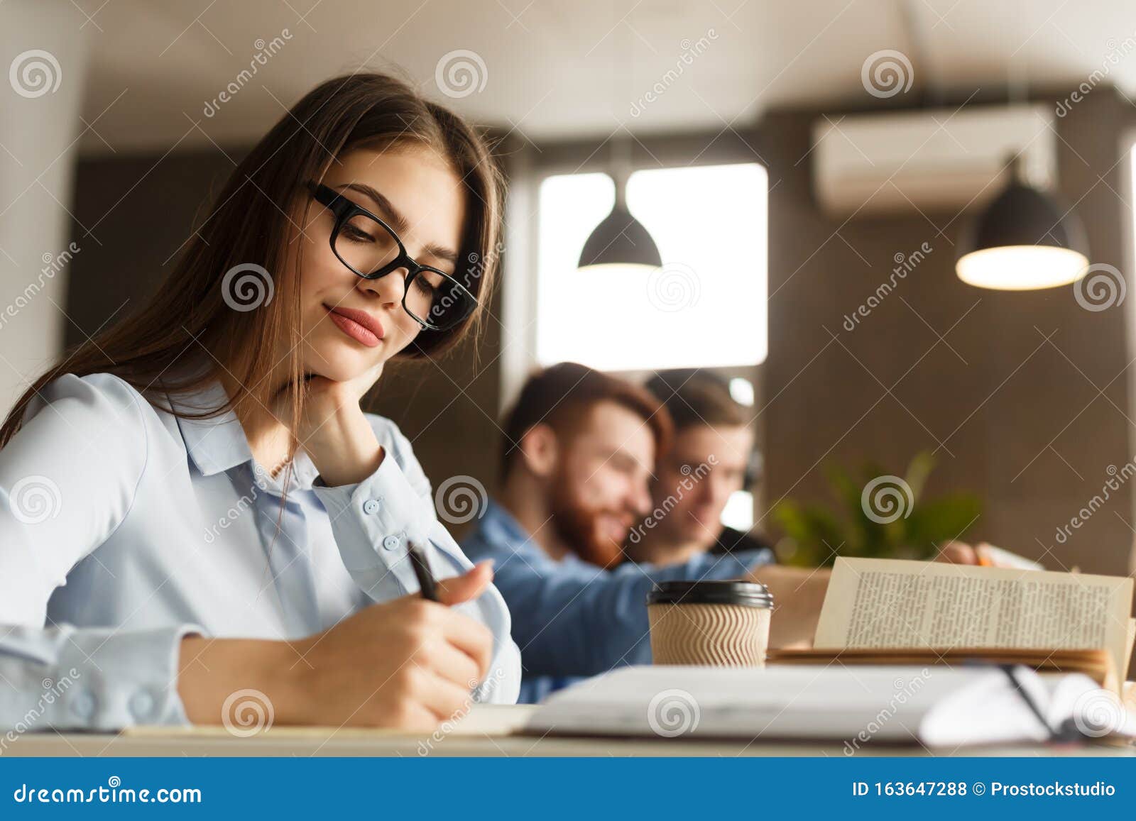 Smart Girl Student Studying at Library, Writing Essay Stock Photo ...