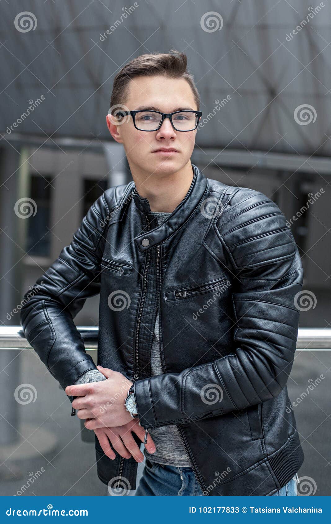 Smart Guy in Eyeglasses and Black Leather Jacket in Front of the ...