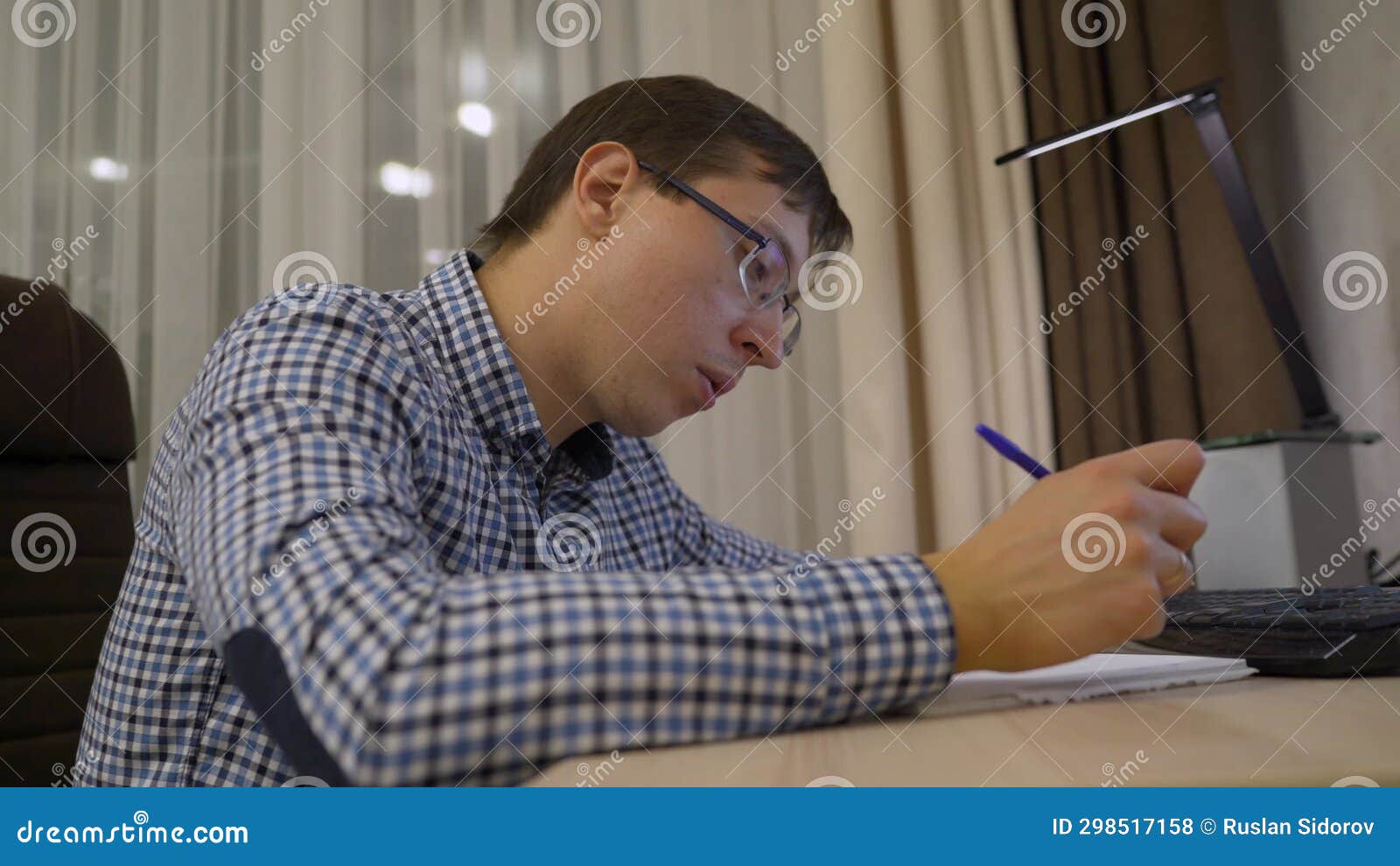 Smart Guy Solves Problems at Home at the Table. Math Tutor. a Pensive ...