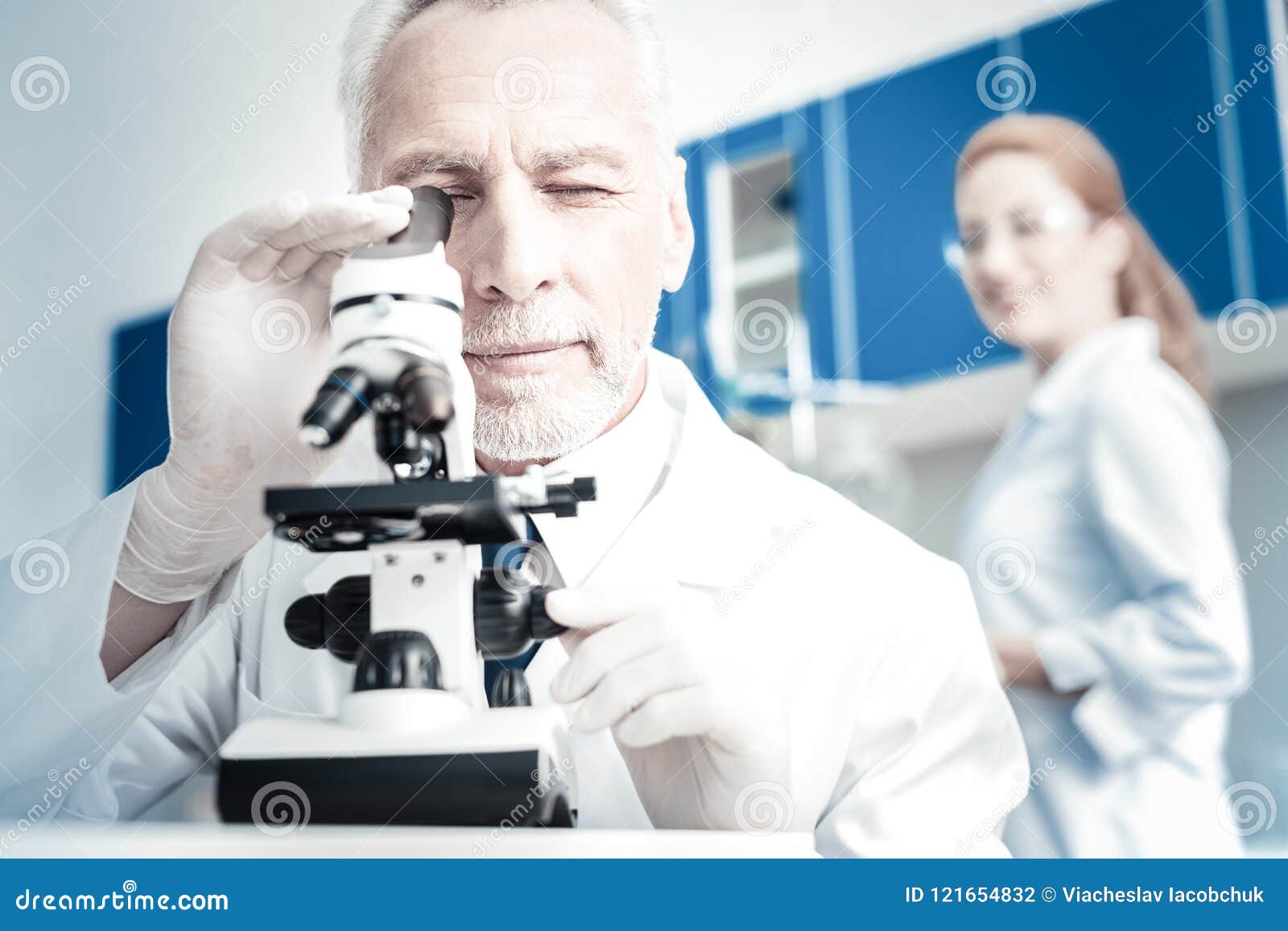 Smart Handsome Biologist Looking into the Microscope Stock Photo ...