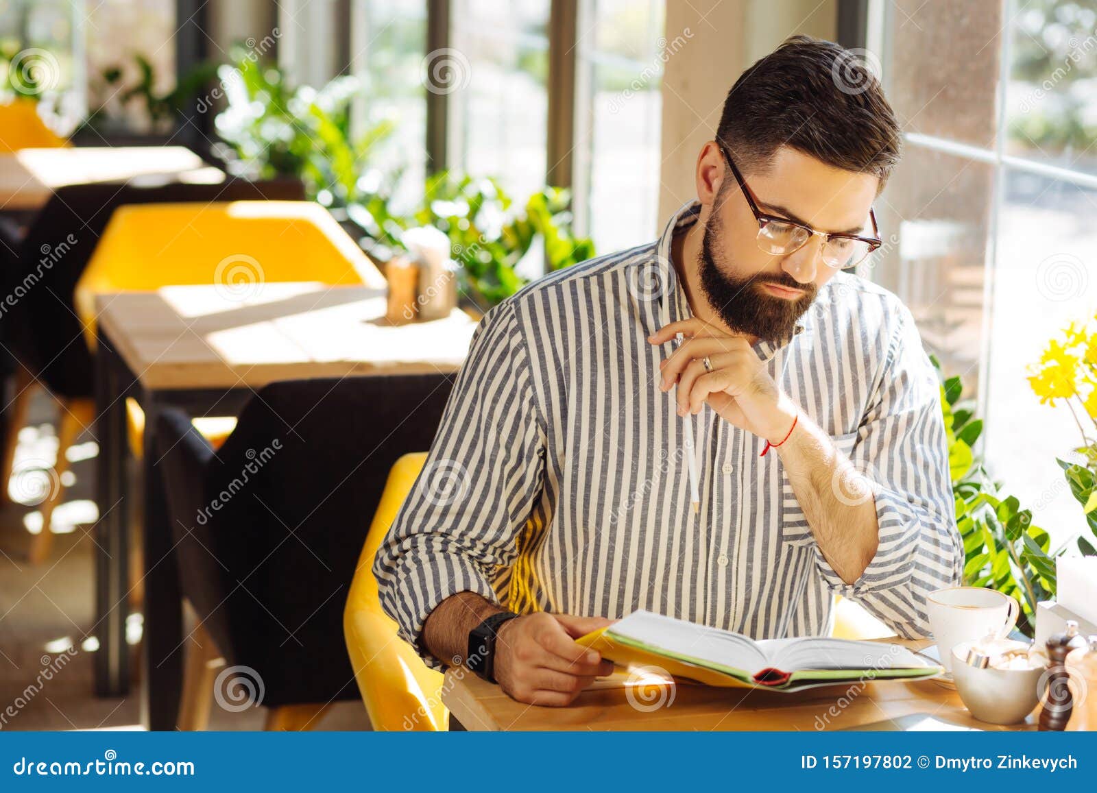 Smart Handsome Man Studying New Material in the Book Stock Photo ...
