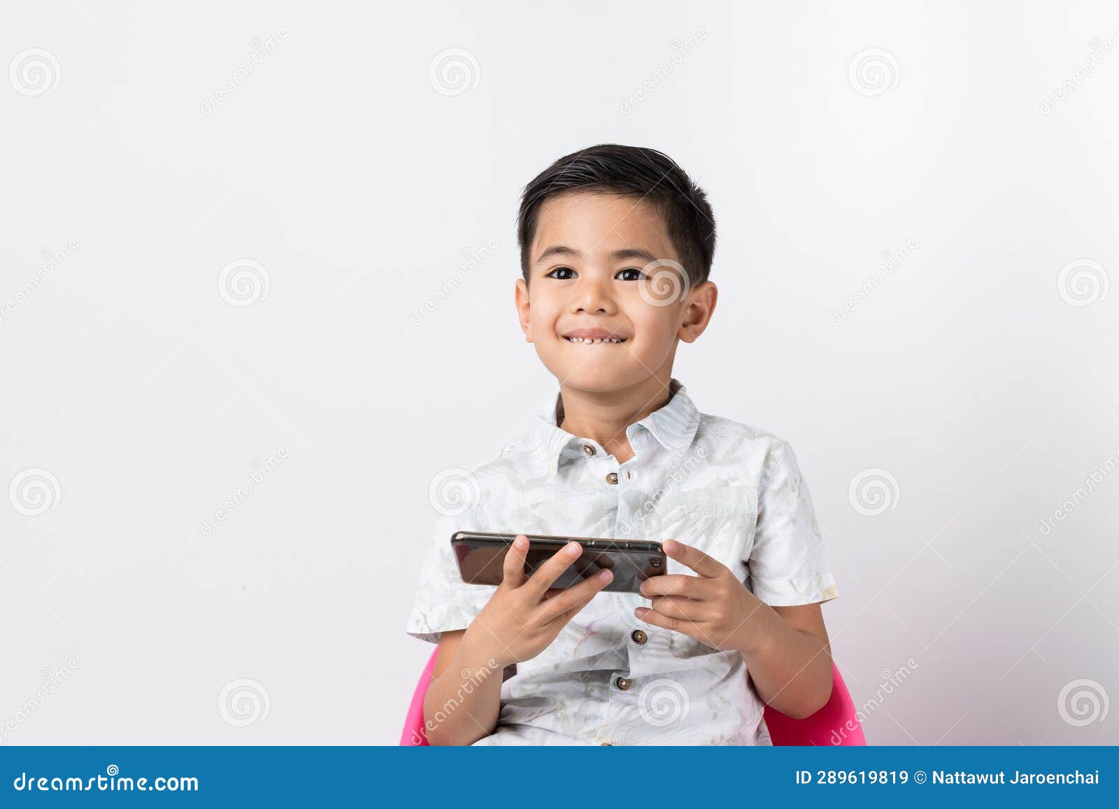 Boy using smartphone stock image. Image of asian, children - 289619819
