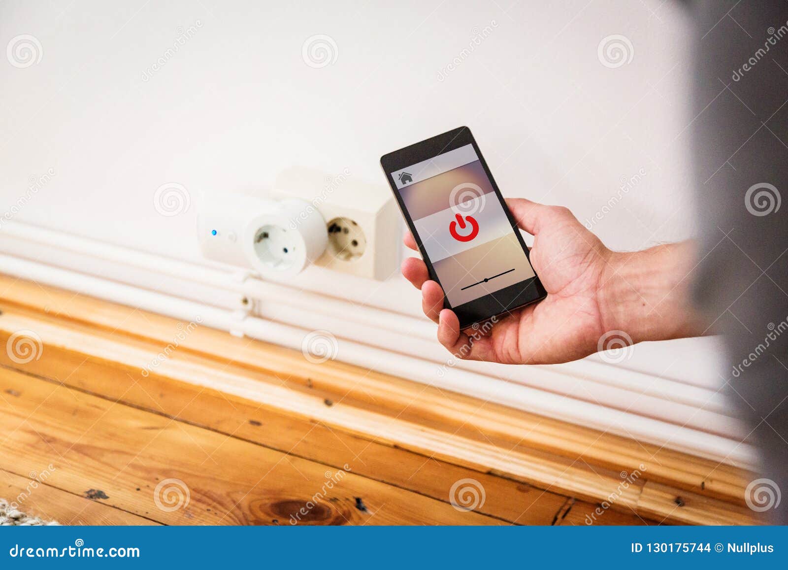 Man Programming a Power Outlet Using His Phone Stock Photo - Image of ...