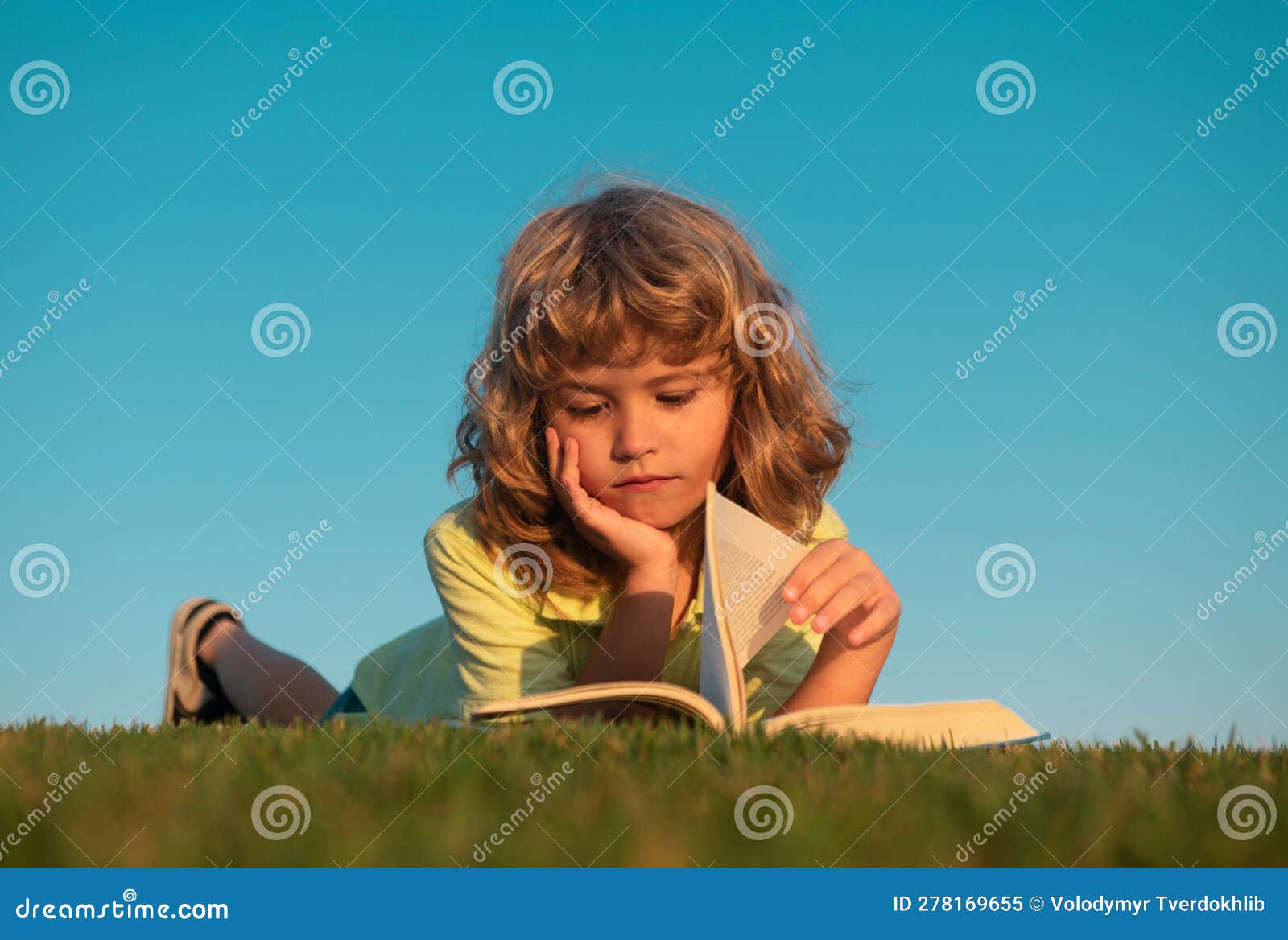 Smart Kid Boy Reading Book in Park Outdoors. Stock Image - Image of ...