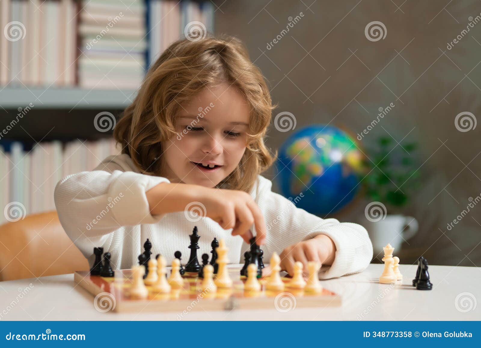 Smart Kid Playing Chess. Clever Child Thinking about Chess. Stock Photo ...