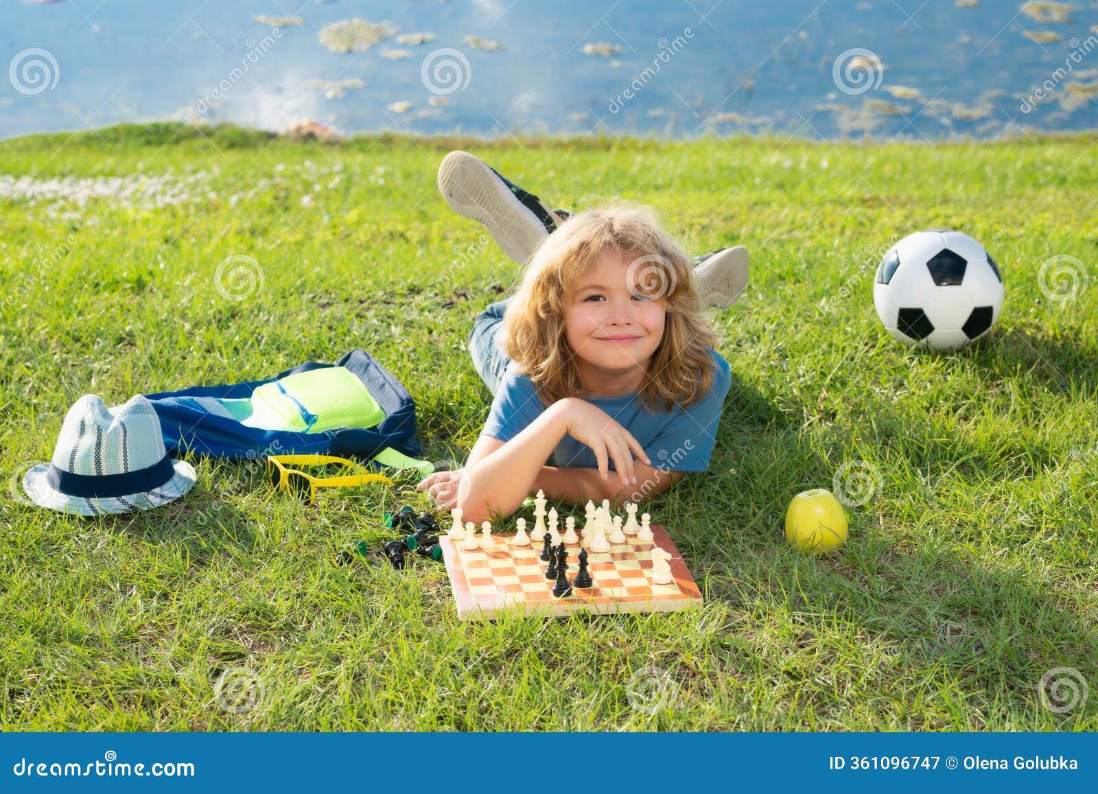 Clever Child Boy Student With Yellow Light Bulb And Question Marks On ...