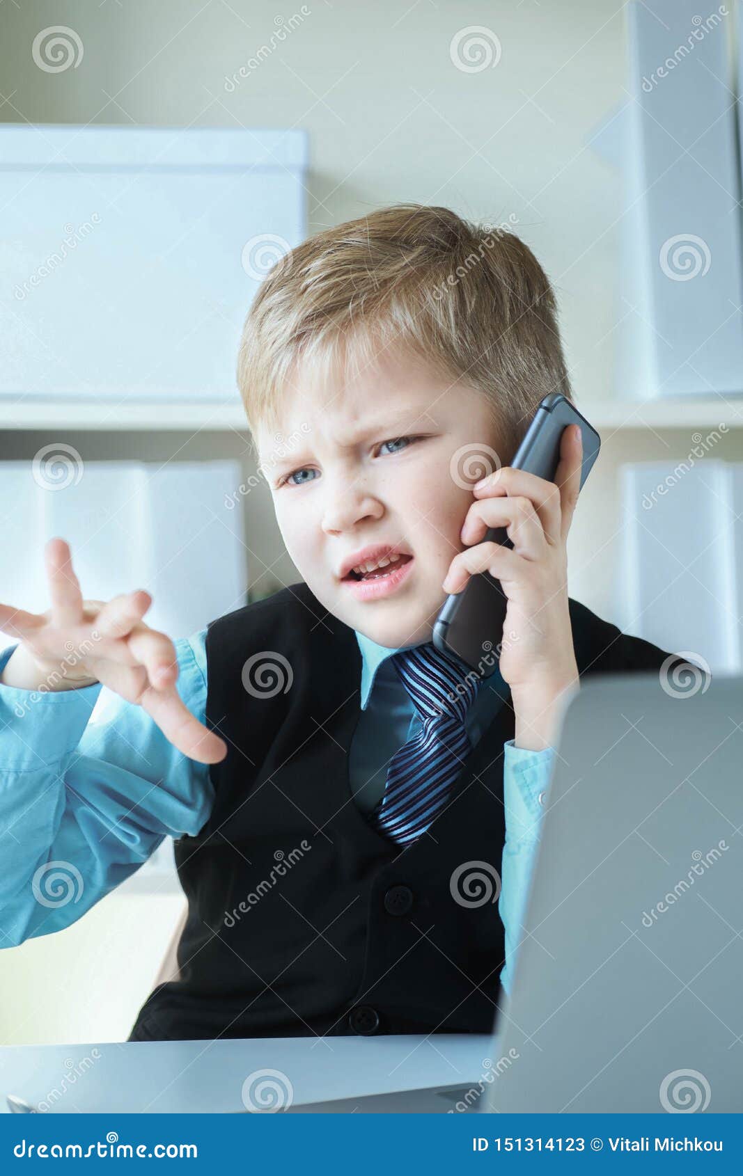 Smart Little Boy, Working on Computer, Taking Notes and Speaking on the ...