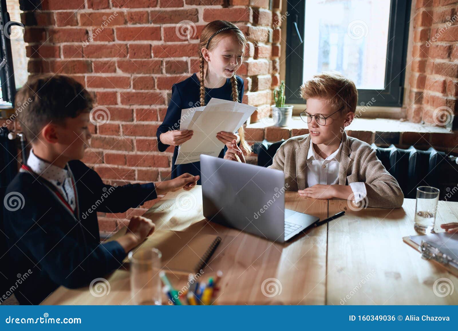 Smart Little Ginger Boy in Glasses Working on Computer, Taking Notes ...