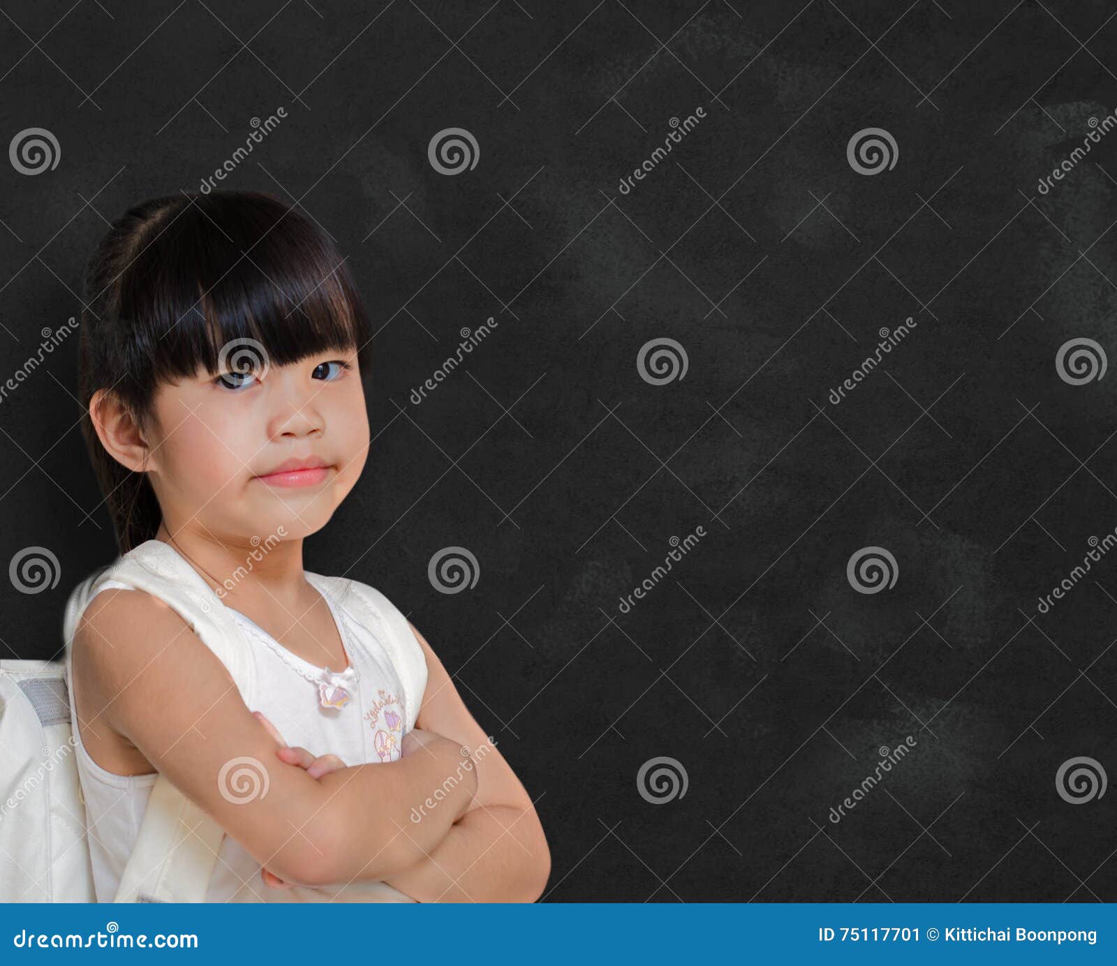 Smart Little Girl Smiling in Front of a Blackboard. Stock Image - Image ...