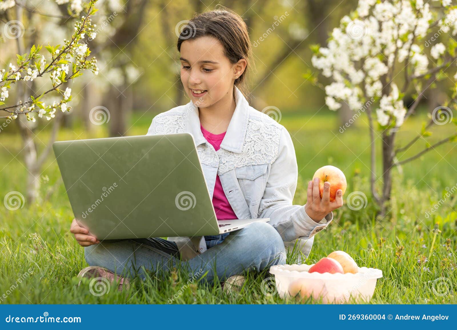 Smart Little Girl Using Her Laptop in the Garden. Stock Photo - Image ...
