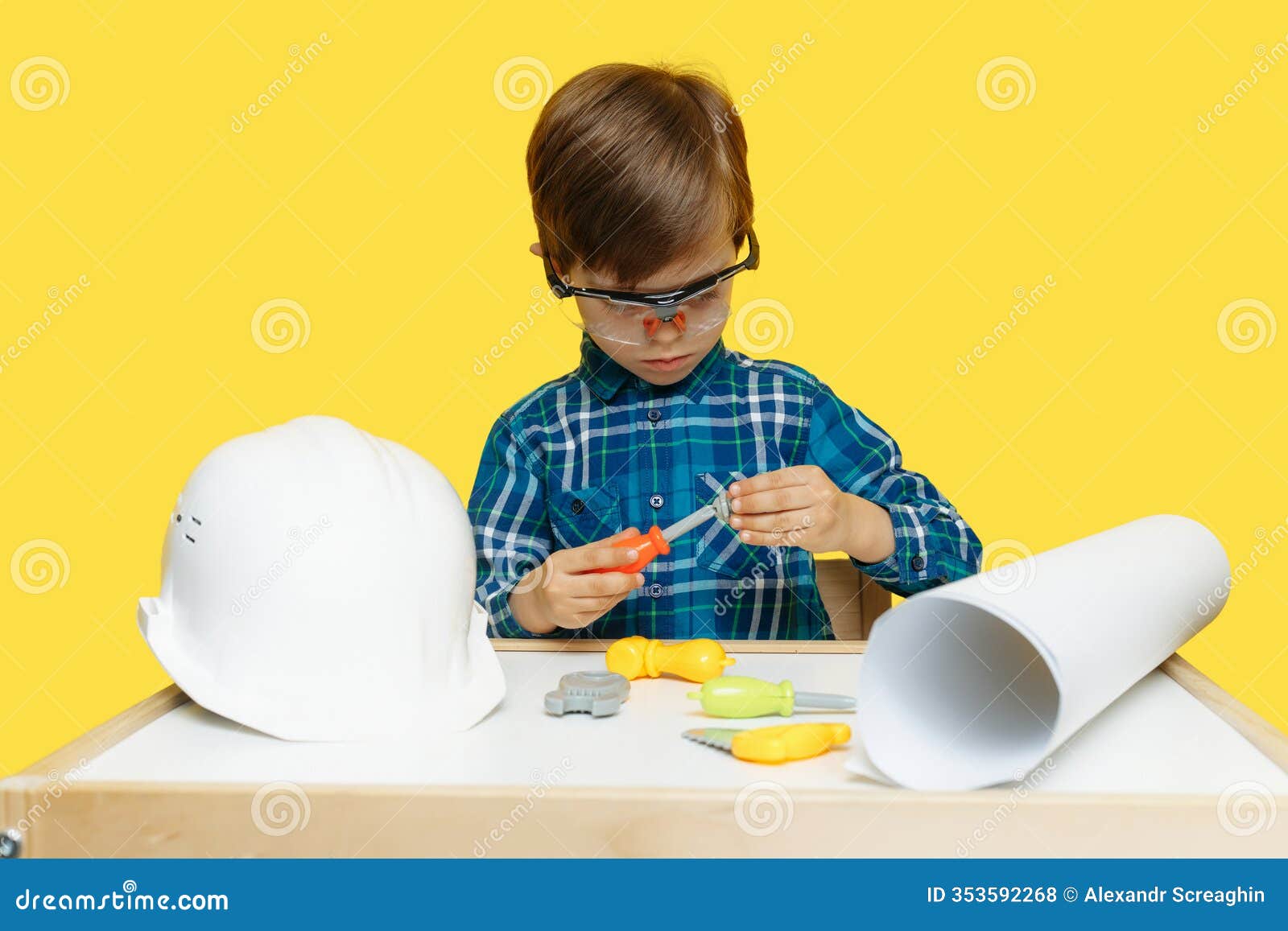 Smart Little Kid Boy Engineer or Architect Sitting at the Work Table ...