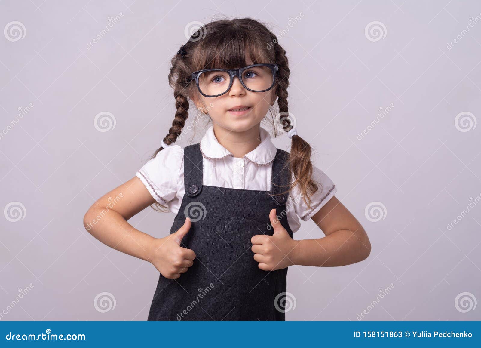 Smart Little School Child Got a Bright Idea on Grey Background. Small ... Smart Little School Child Got a Bright Idea on Grey Background. Small ...