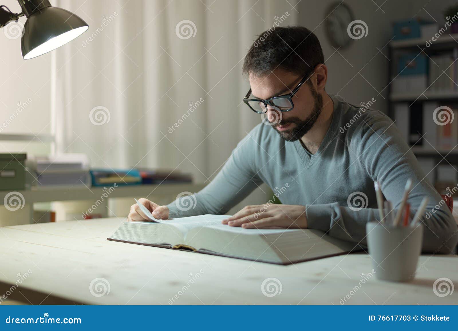 Smart Man Studying at Night Stock Image - Image of dark, student: 76617703