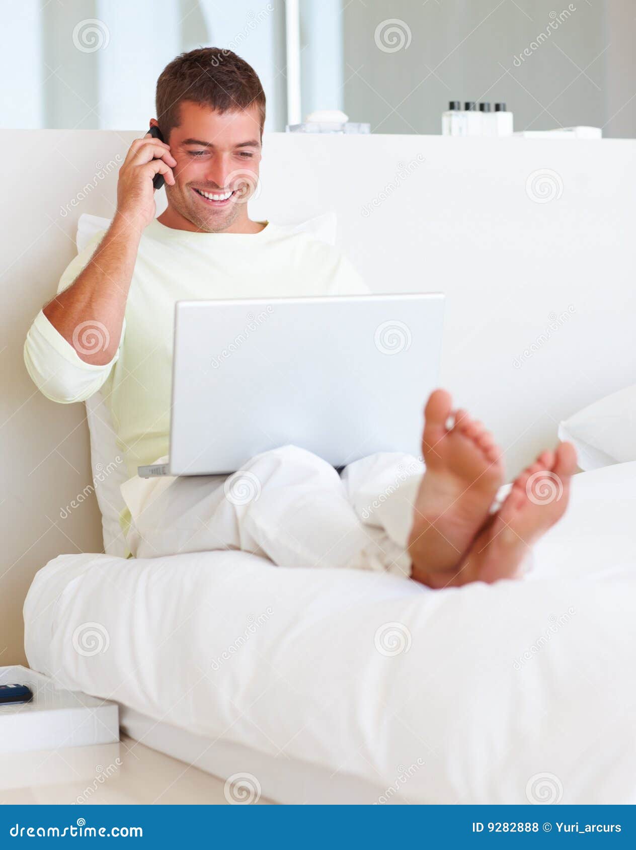 Smart Man Talking on Mobile with a Laptop in Front Stock Photo - Image ...