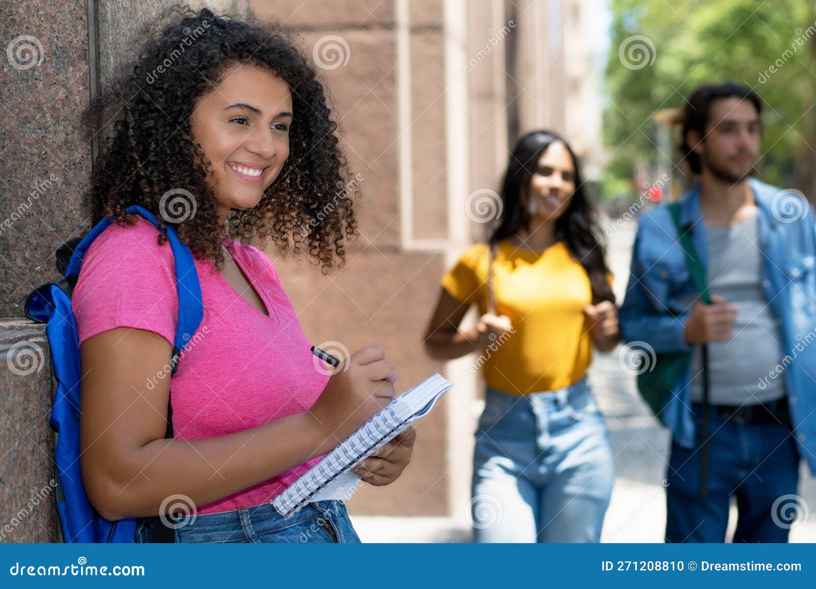 Smart Mexican Female Student Writing Notes in Front of University ...