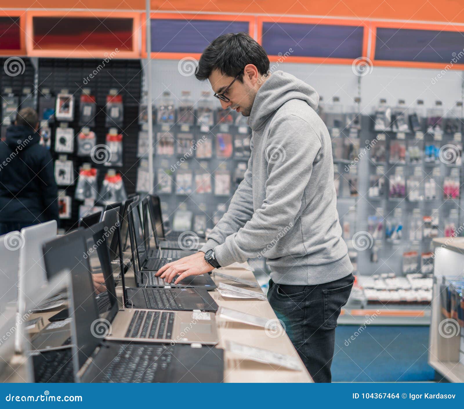 Modern Male Customer Choosing Laptop in the Computer Shop Stock Photo ...