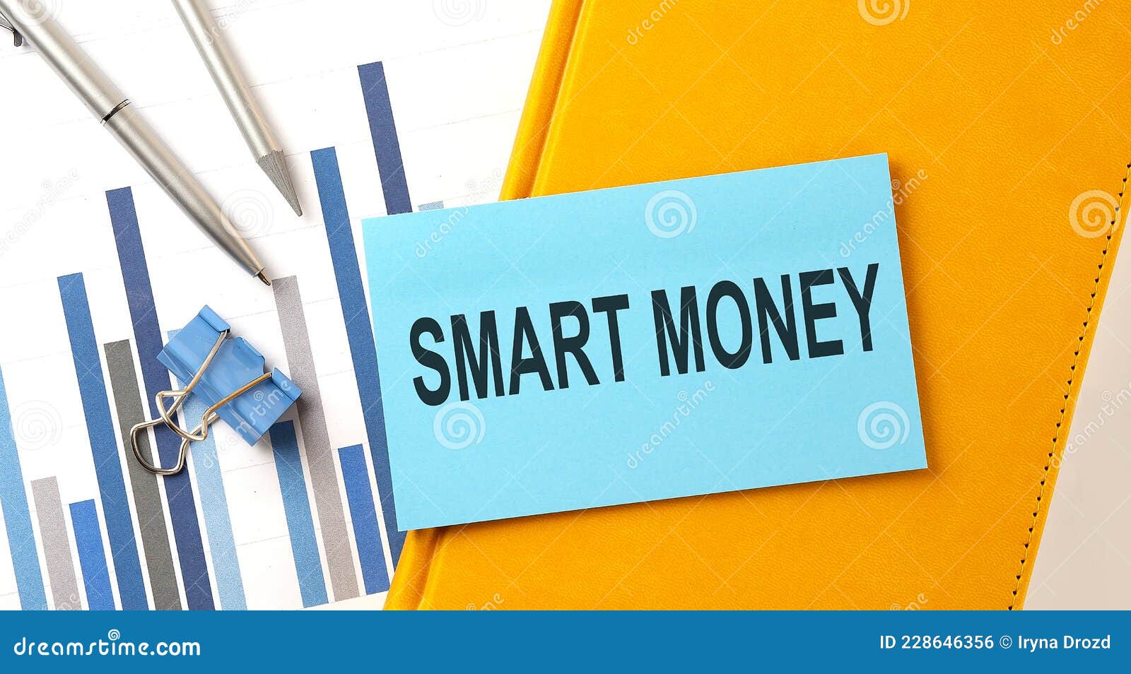 SMART MONEY Text on Sticker on the Yellow Notebook with Chart and Pen ...