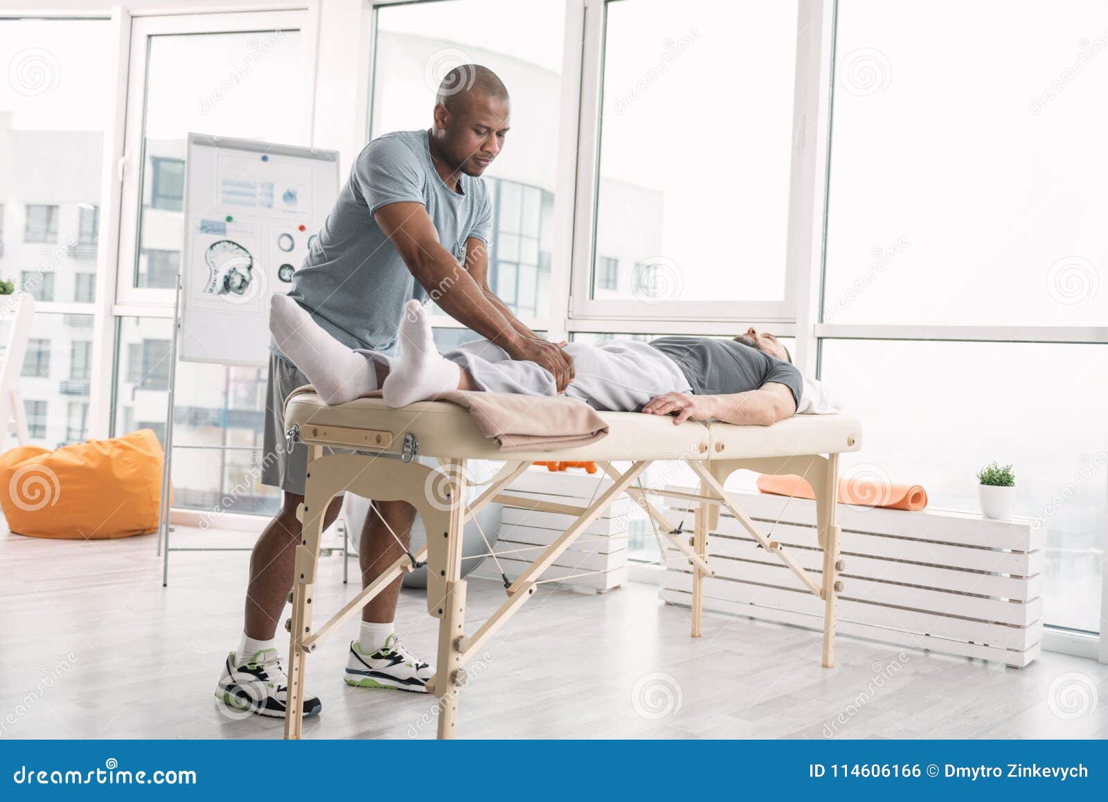 Smart Nice Man Doing the Therapy Procedures Stock Photo - Image of care ...