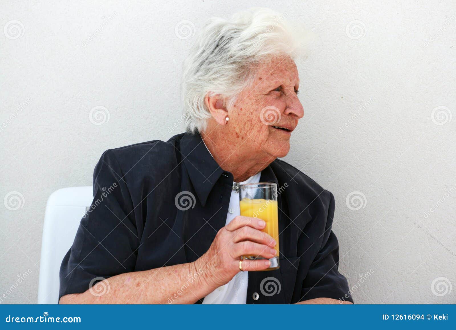 Smart Old Lady with Orange Juice Stock Photo - Image of aged ...
