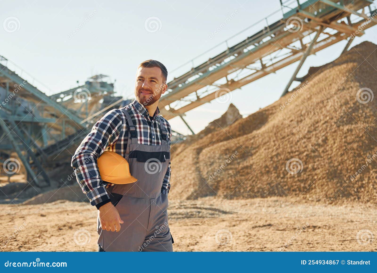 Smart Person. Construction Worker in Uniform is on the Quarry Stock ...