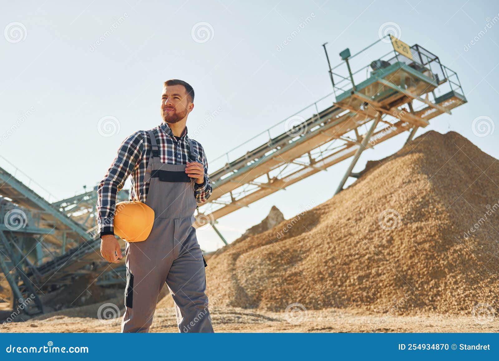 Smart Person. Construction Worker in Uniform is on the Quarry Stock ...