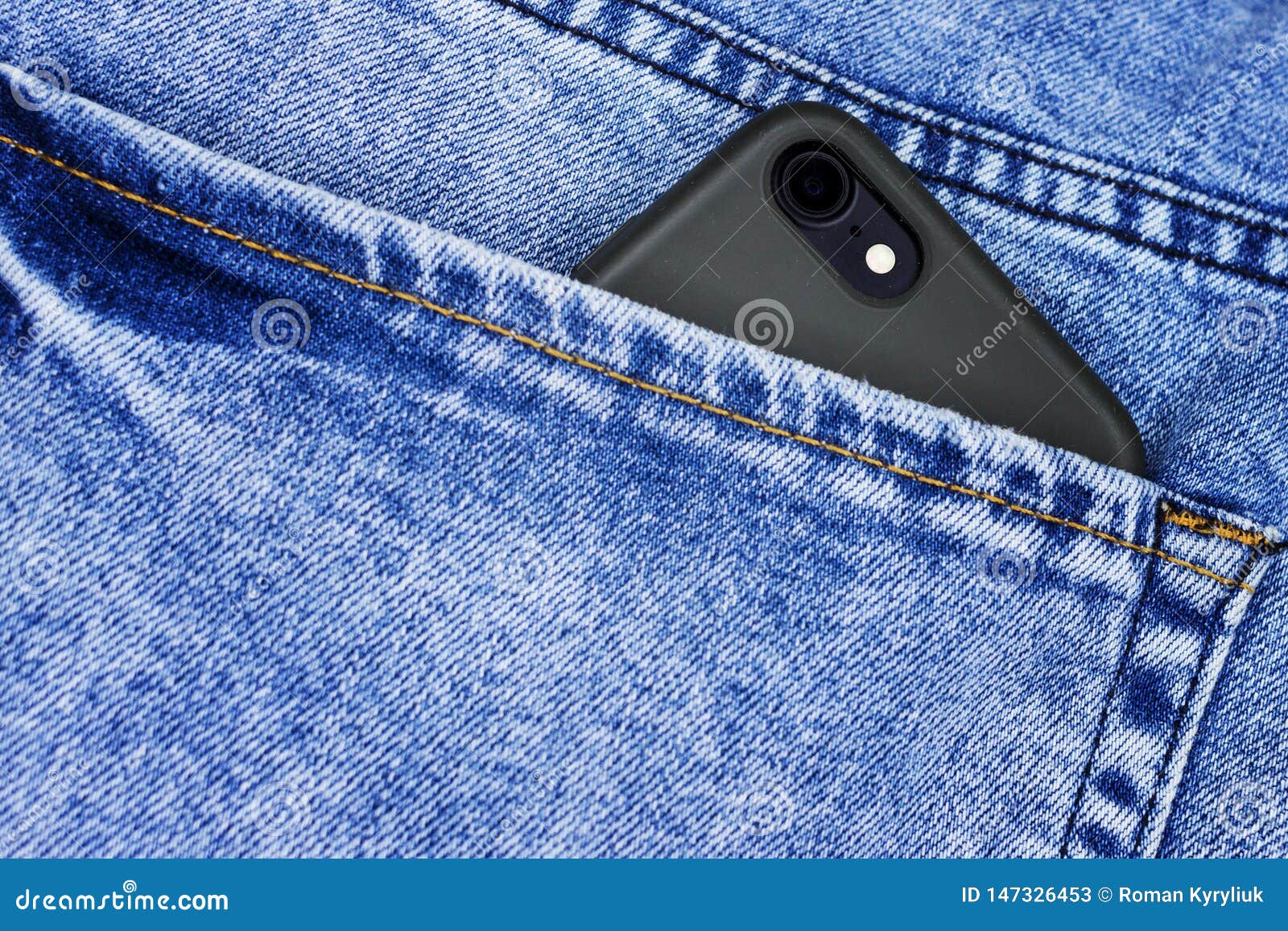 Smart Phone in the Back Pocket of Blue Jeans Stock Image - Image of ...