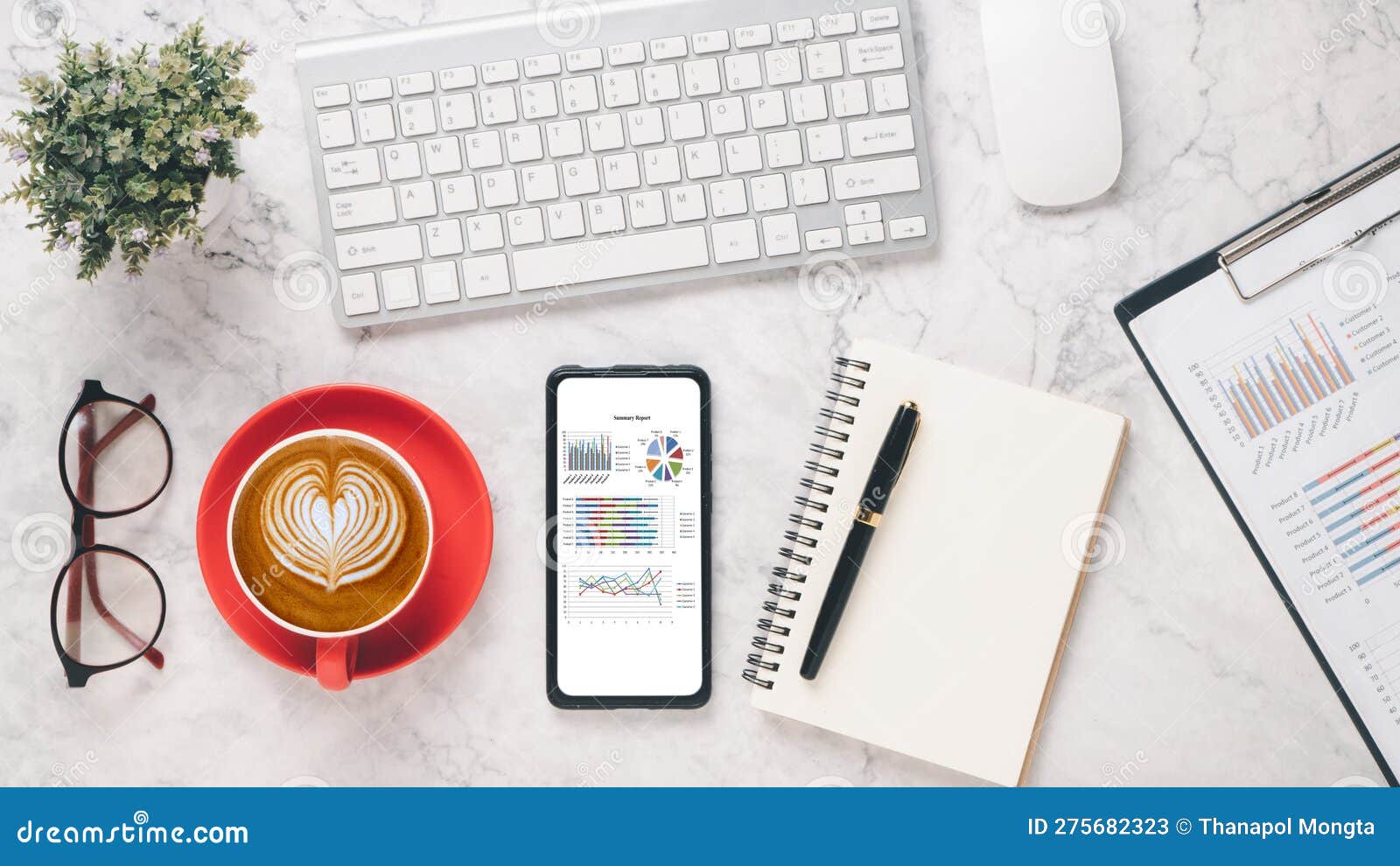 Smart Phone with Charts and Reports on Office Desk Workplace. Stock ...