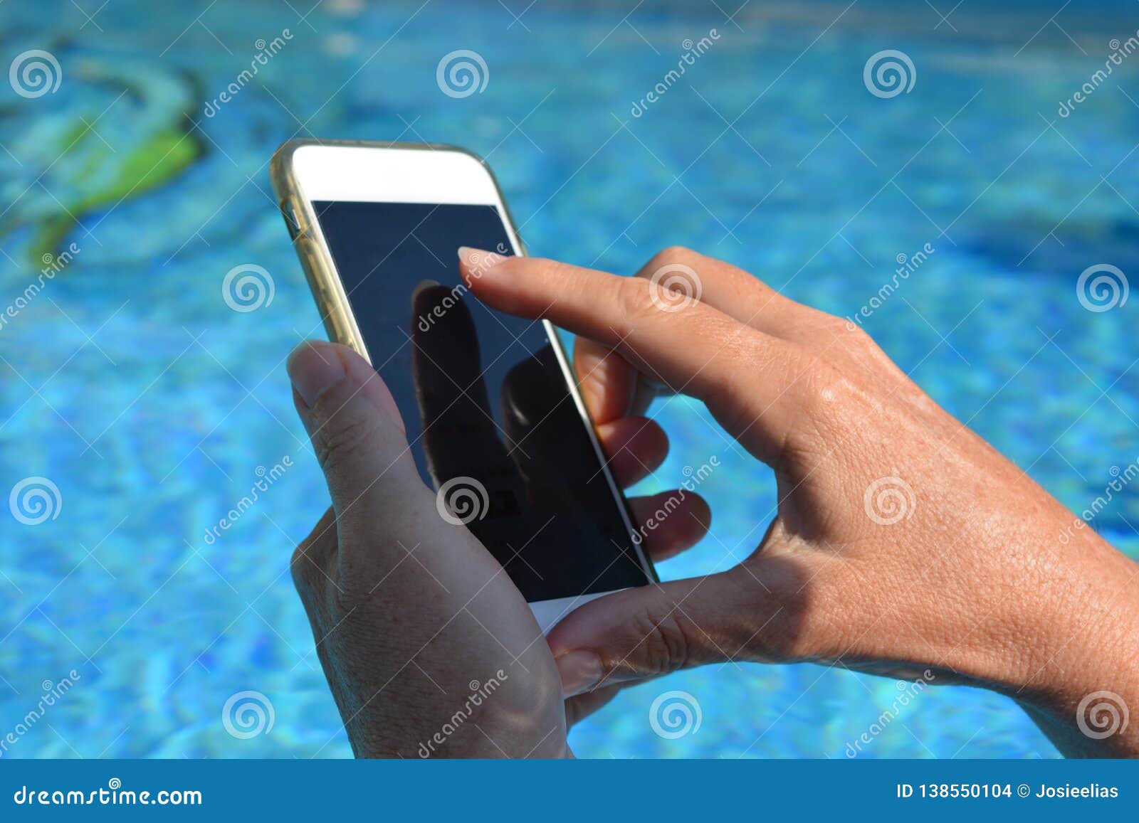 Using Technology, Using a Mobile Phone by a Swimming Pool in Summer ...