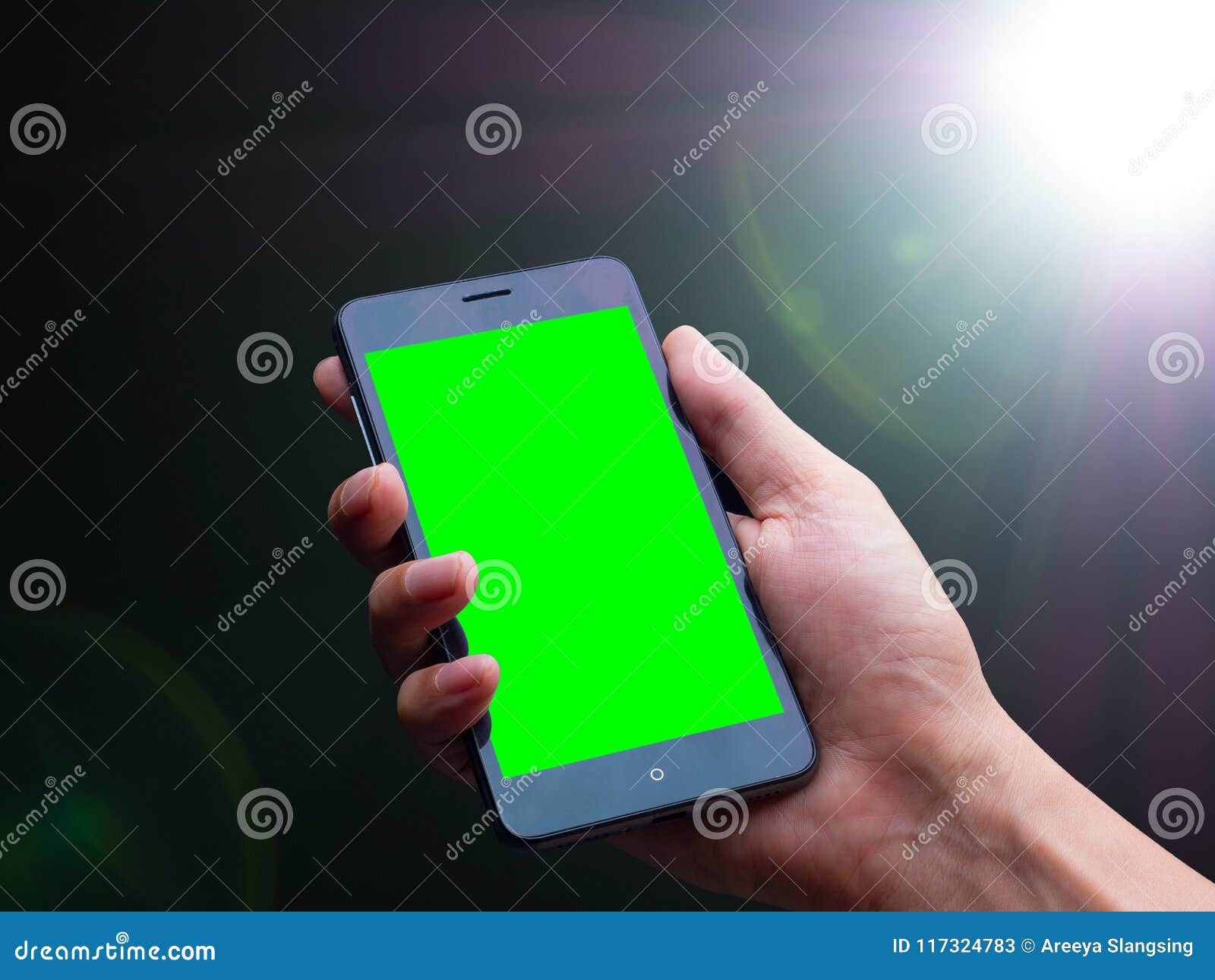 Smart Phone on Lens Flare of Strong Light Source in the Dark Stock ...