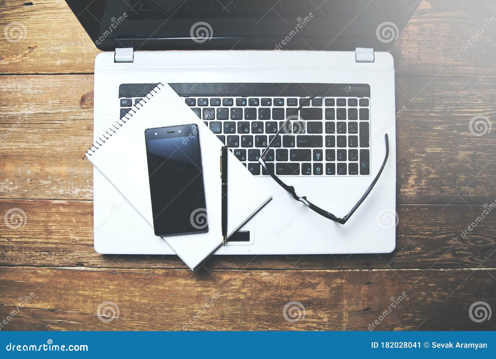Smart Phone on Notepad on Notebook Laptop Stock Image - Image of ...