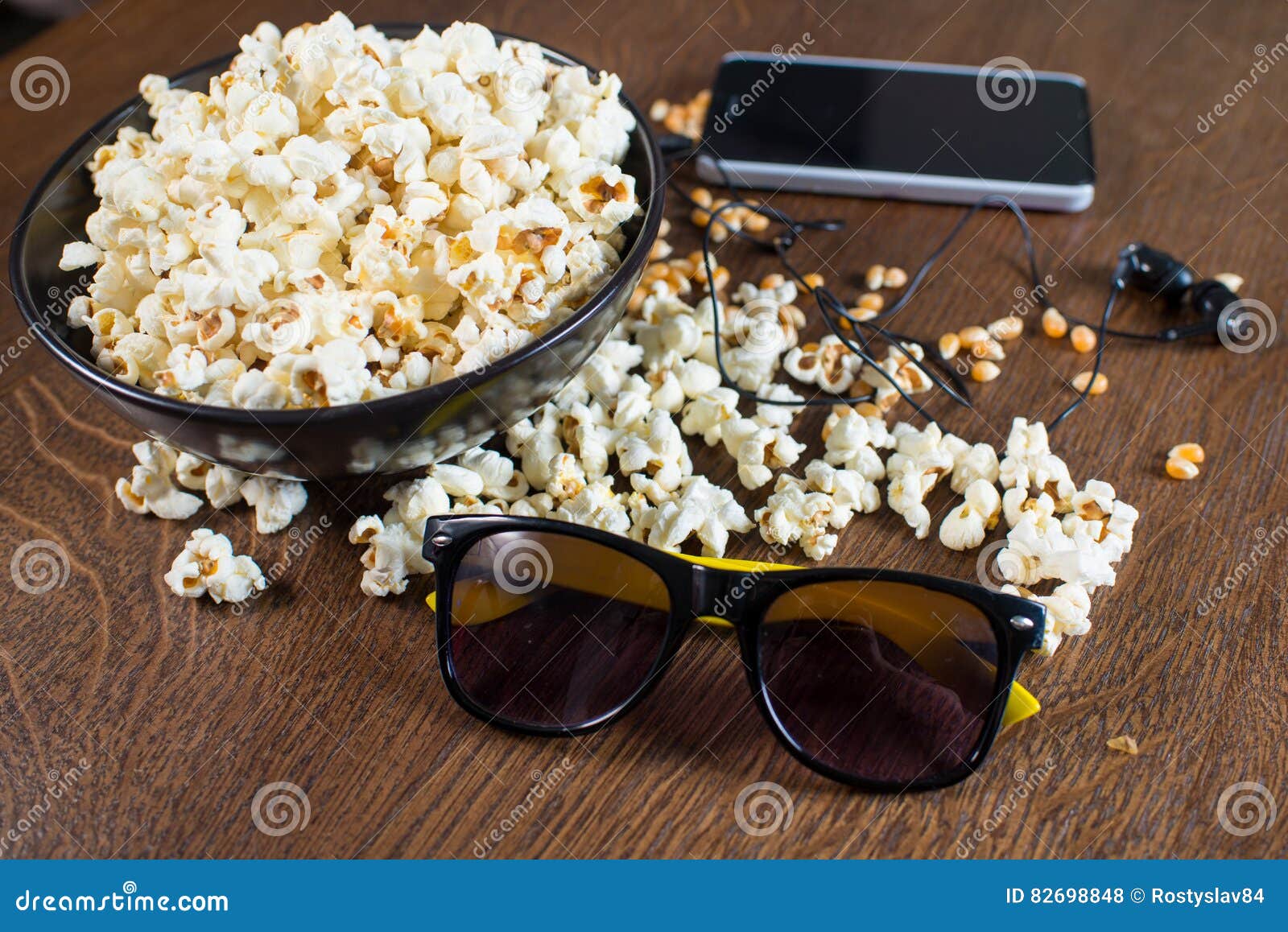 Smart Phone and Plate with Popcorn on the Wooden Table Stock Photo ...